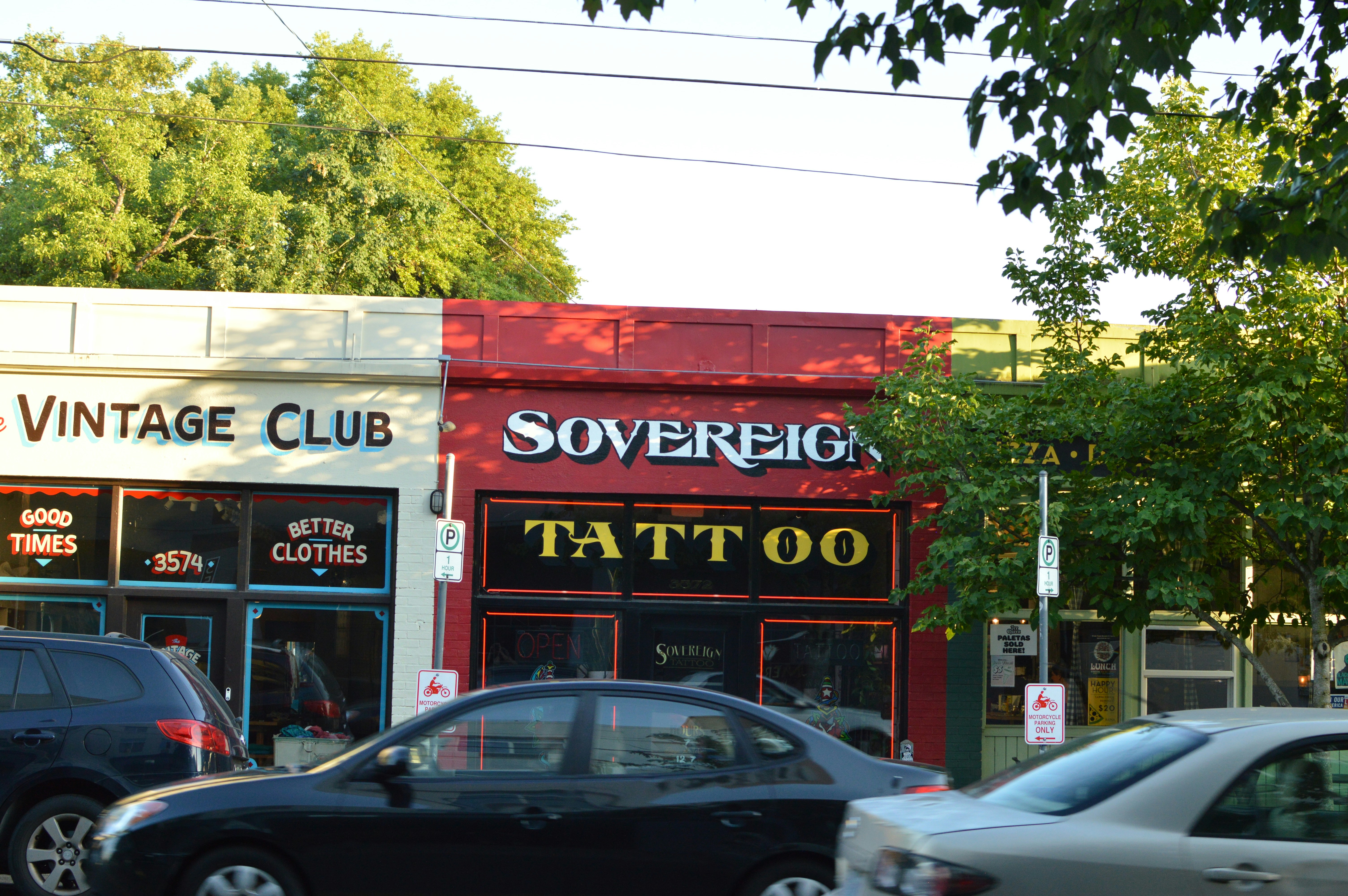 Shopfront Pulse: A Busy Street with Retro Signage