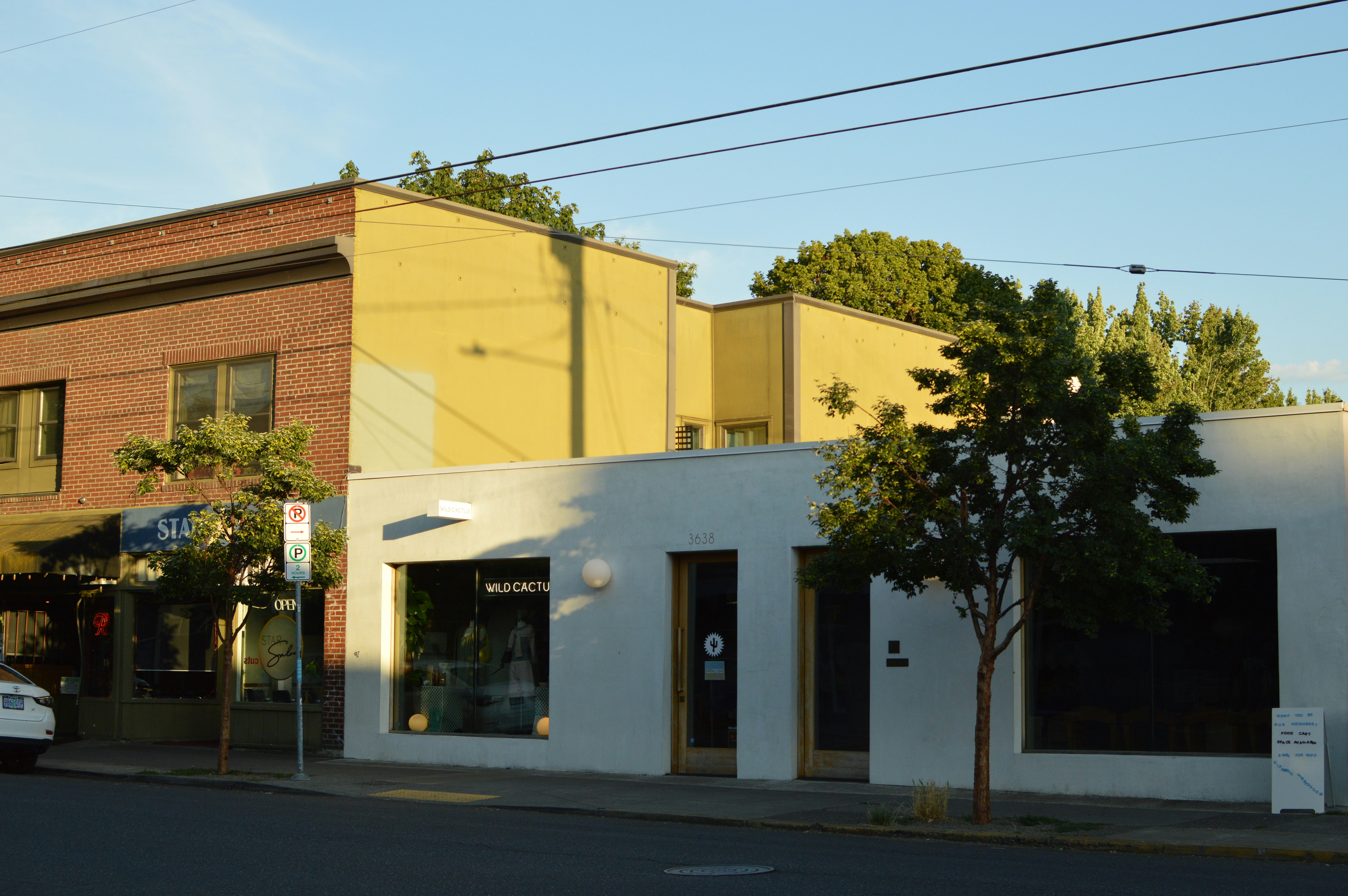 Sunlit Corner: A Quiet Streetfront in Late Afternoon