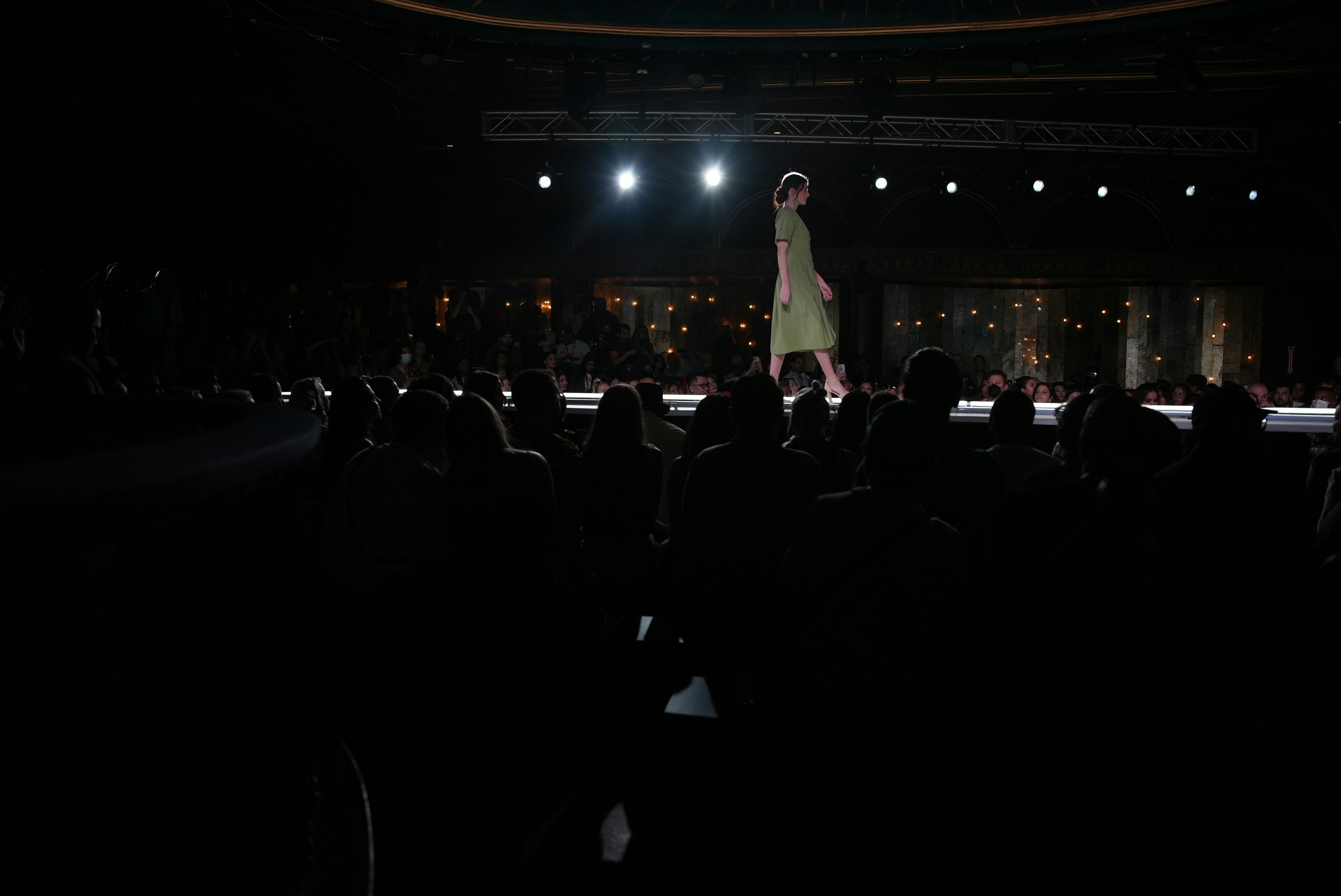 Spotlit Model in a Silent Runway