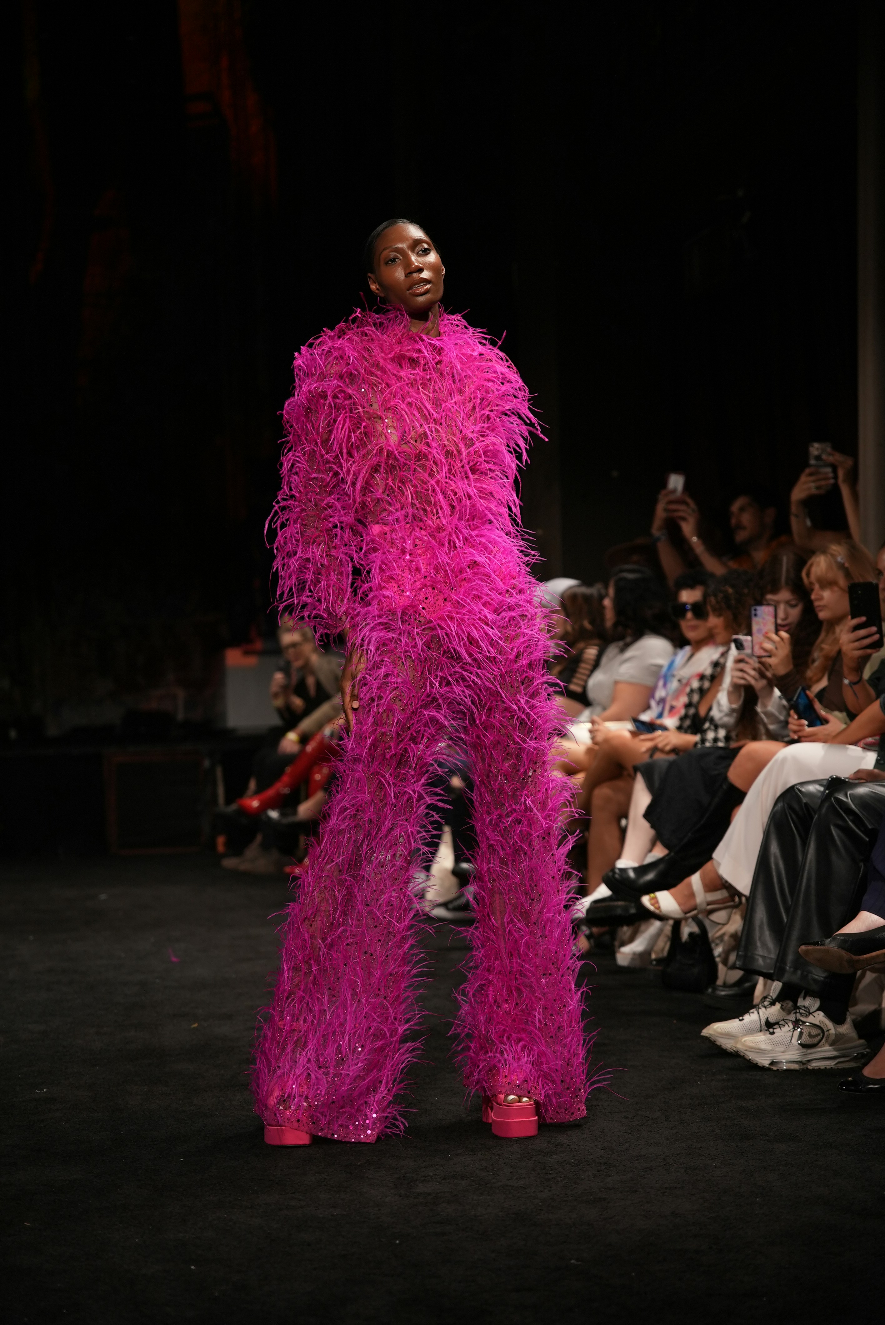 Vivid Feathers on the Runway: A Magenta Statement