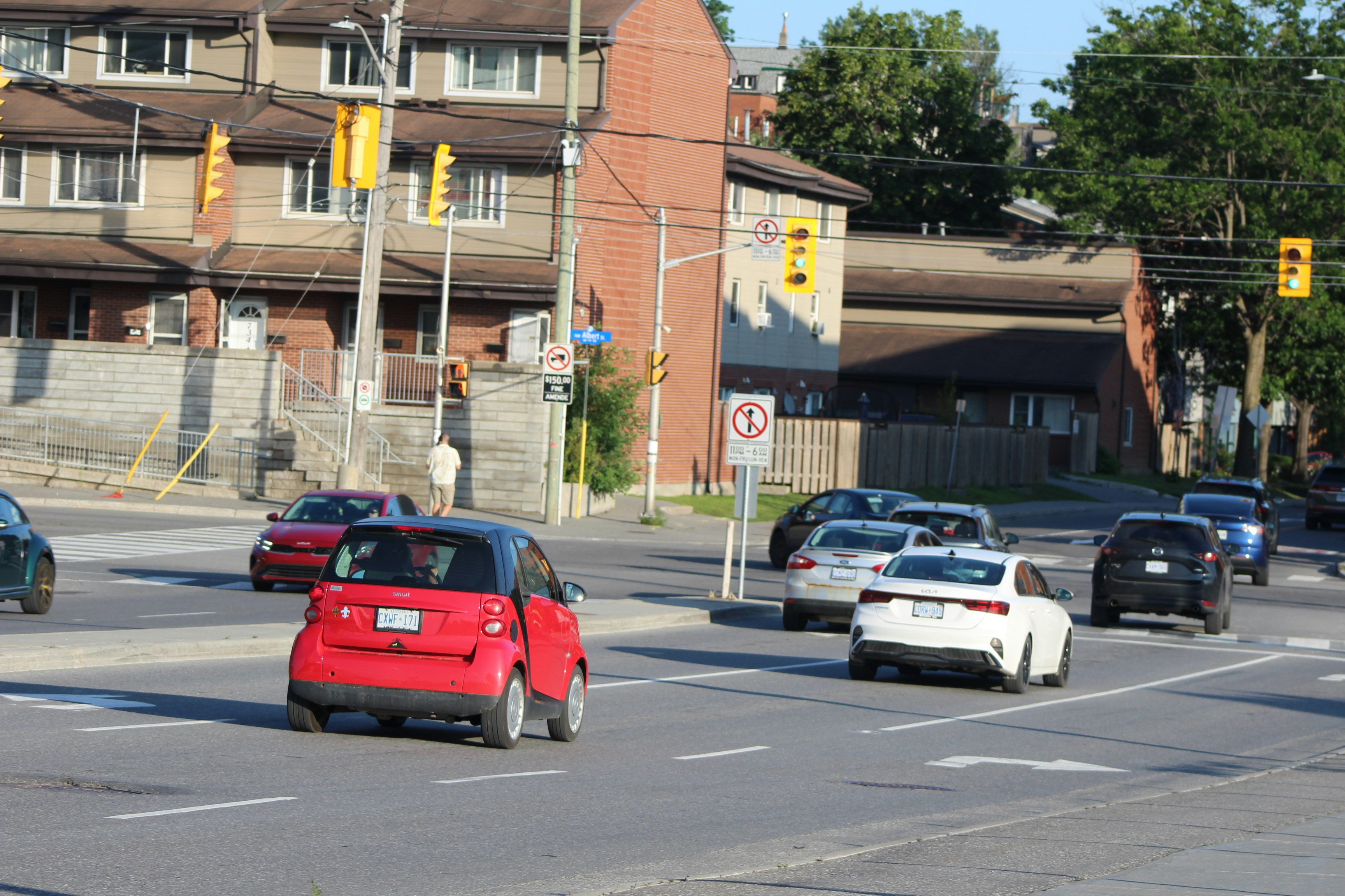 Red Hatch at the Crossroads: A City Moment in Motion