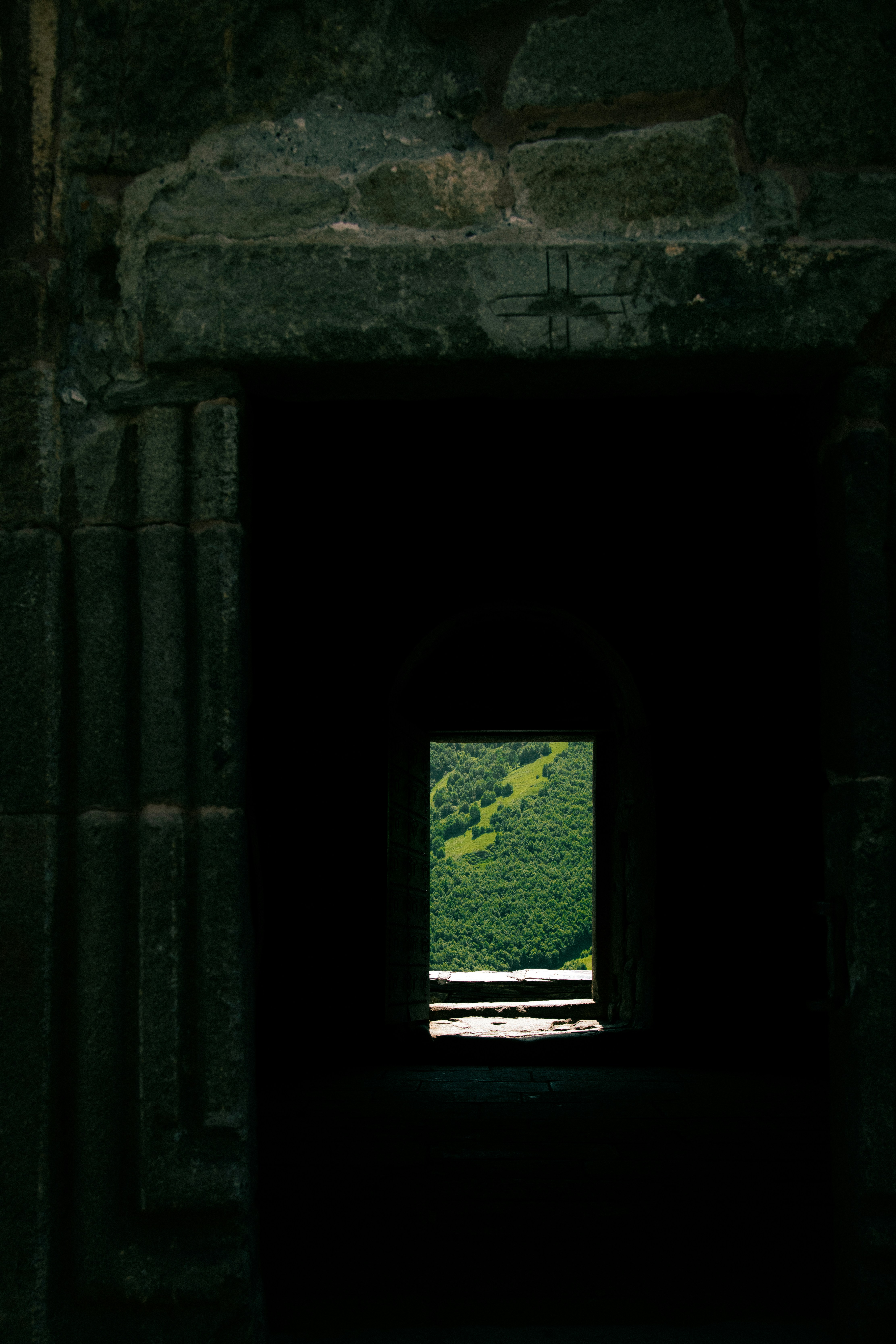 Through the Gate: Light Framed Beyond a Dark Corridor
