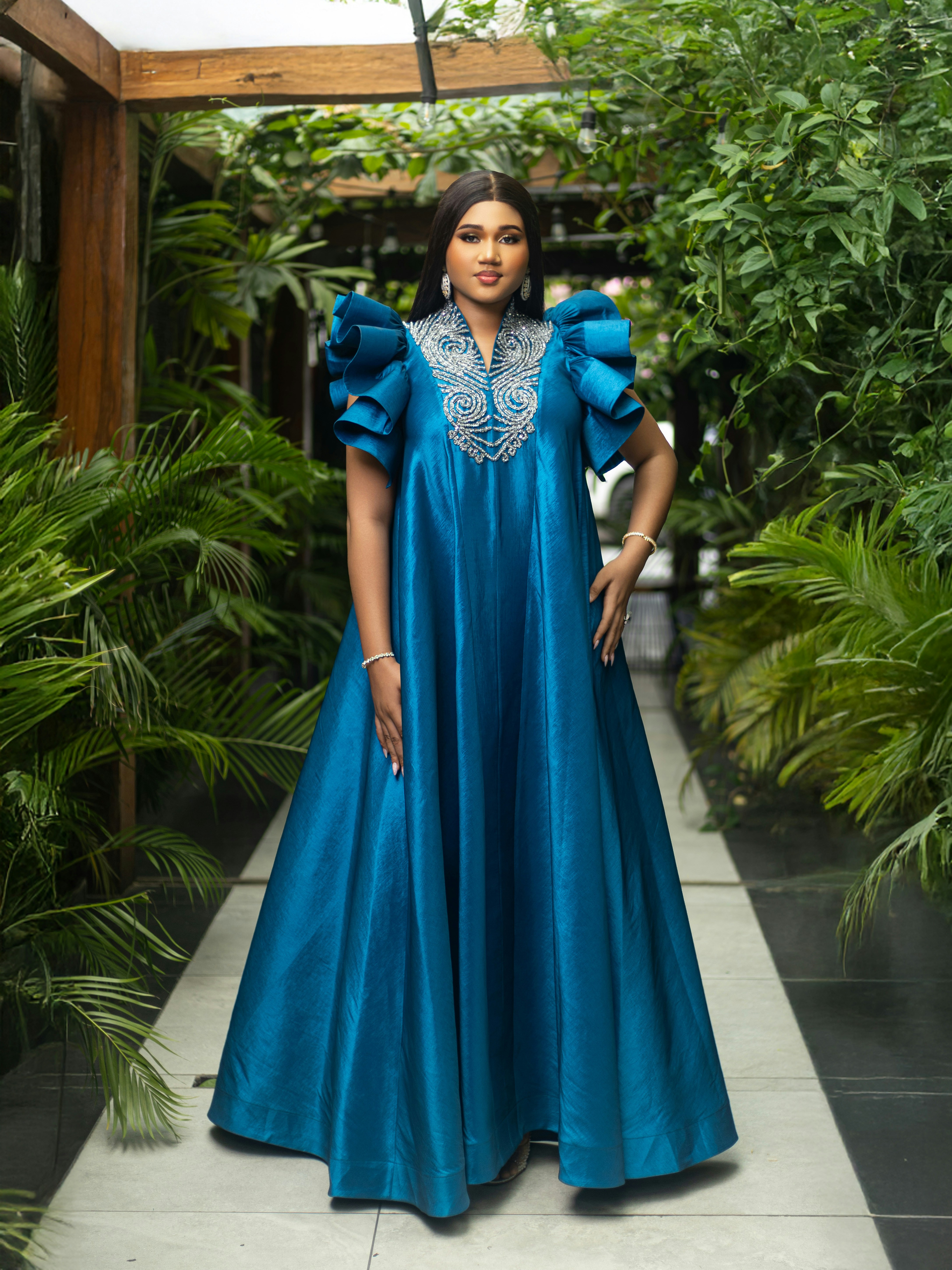 Blue Grace: A Dignified Portrait in a Lush Corridor