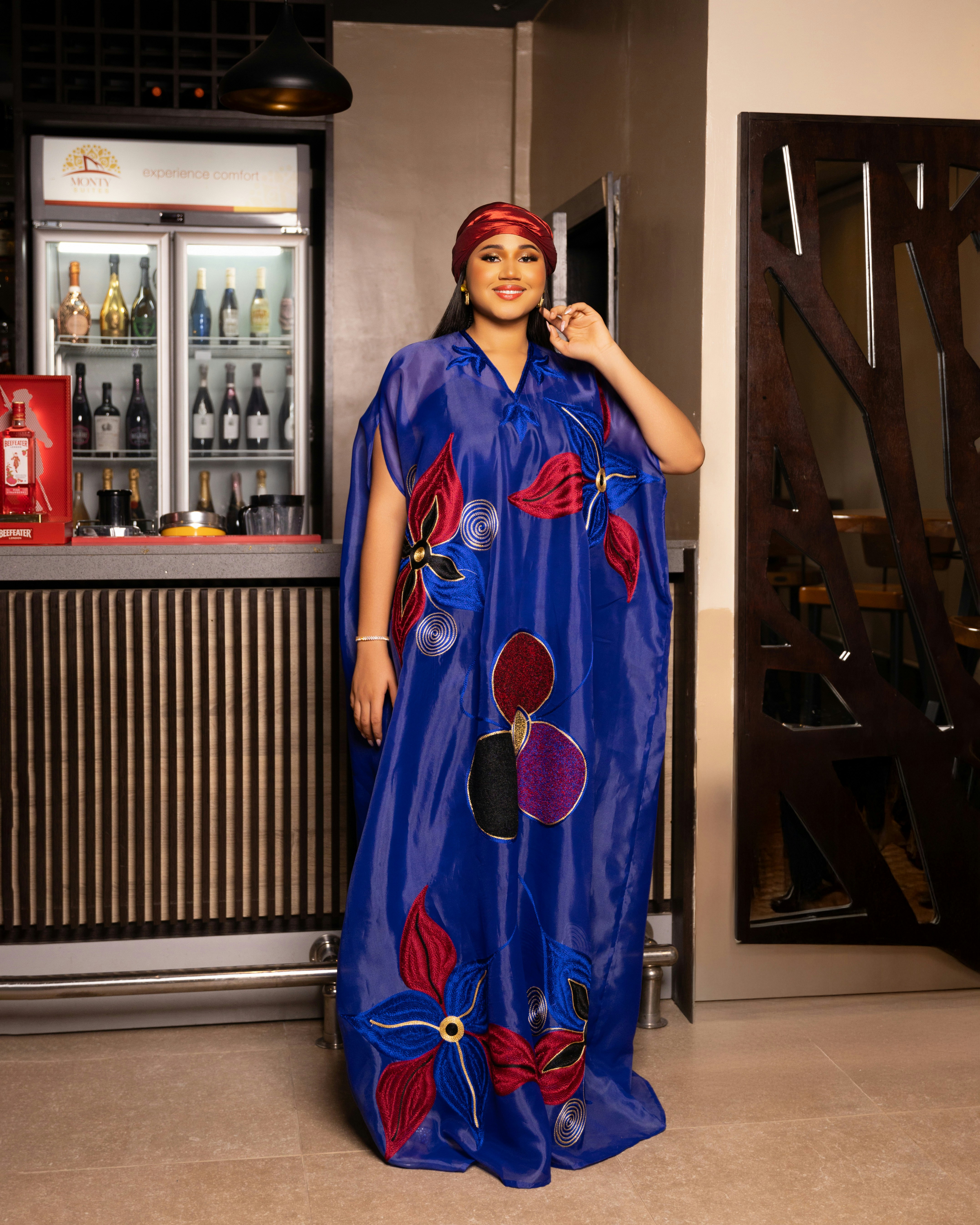 Blue Gown, Warm Lights: A Quiet Portrait in the Bar