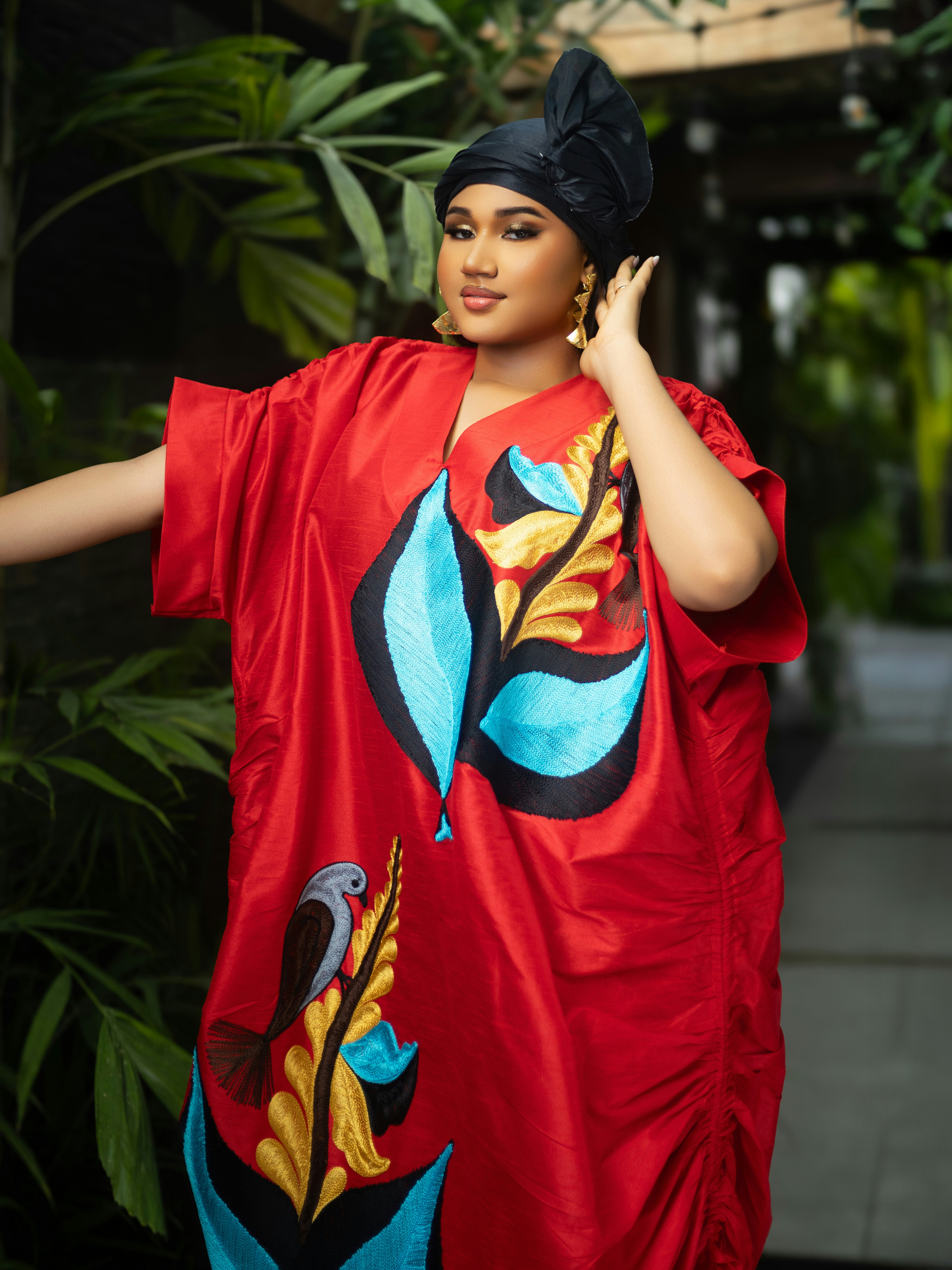 Red Garment, Bold Pose: A Portrait in Colorful Weaves