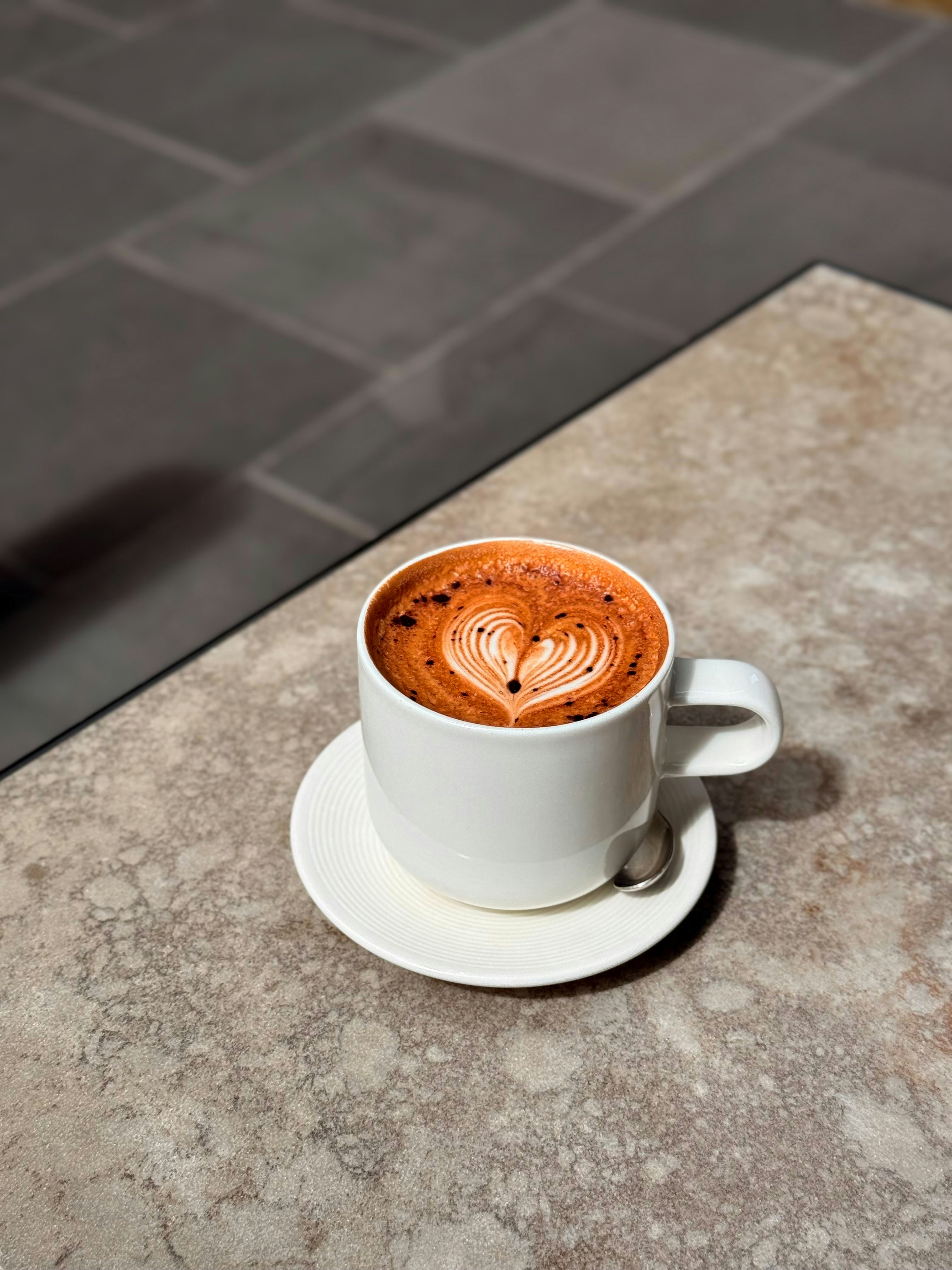 Coffee Crest: Latte Art on a Marble Table