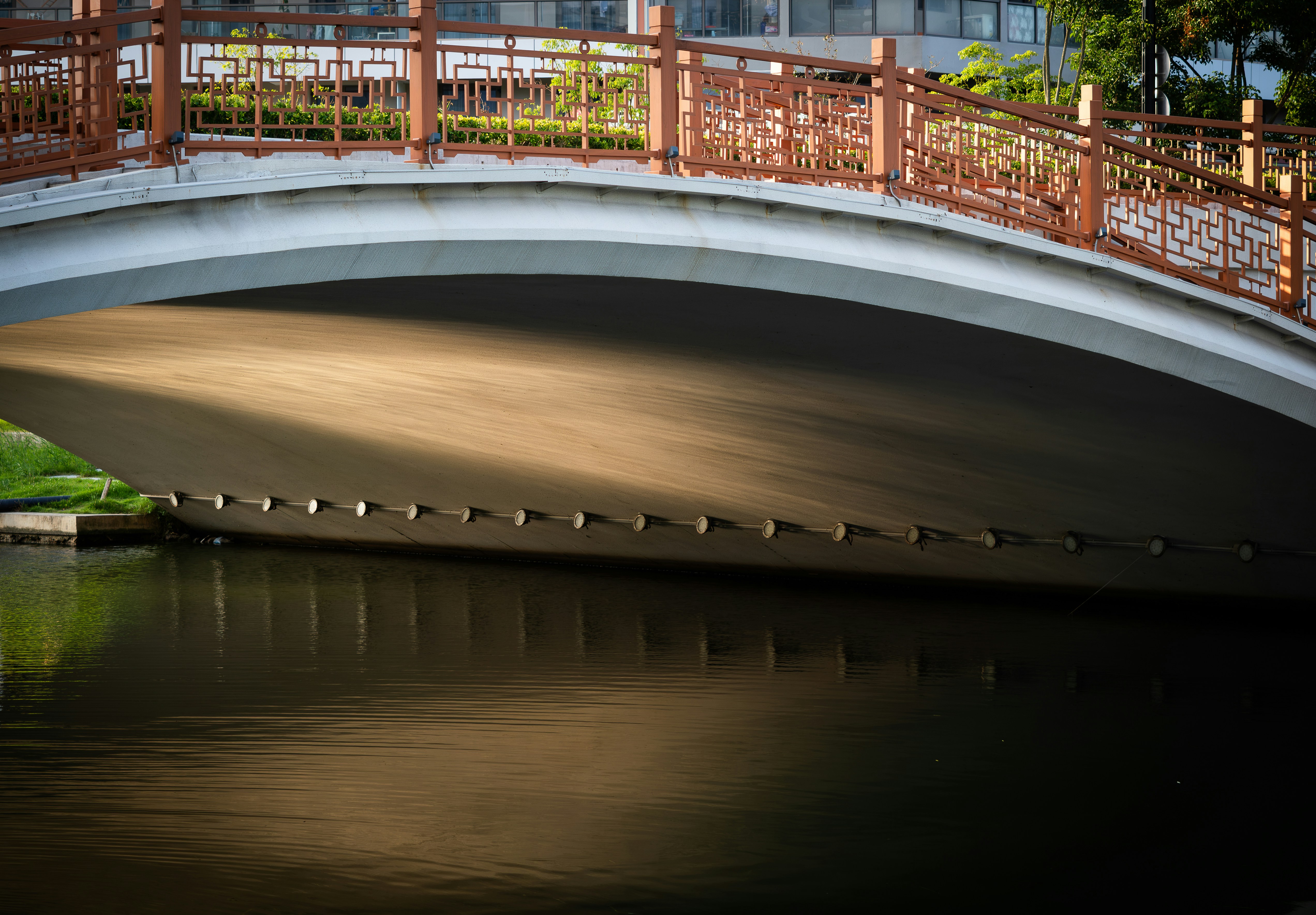 Golden Reflection Under the Pedestrian Bridge
