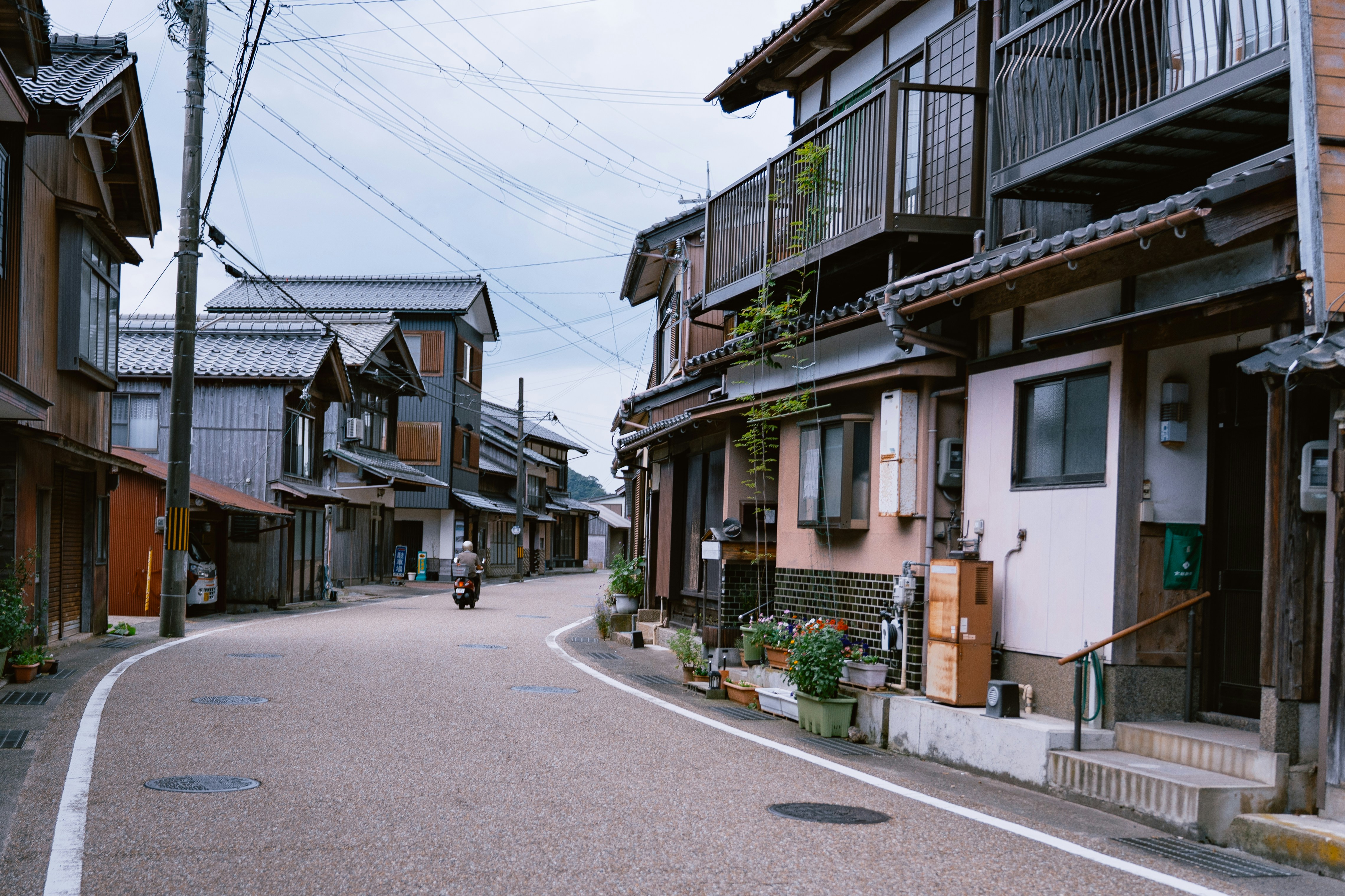 Quiet Alleyway of Wooden Facades and Gentle Curves