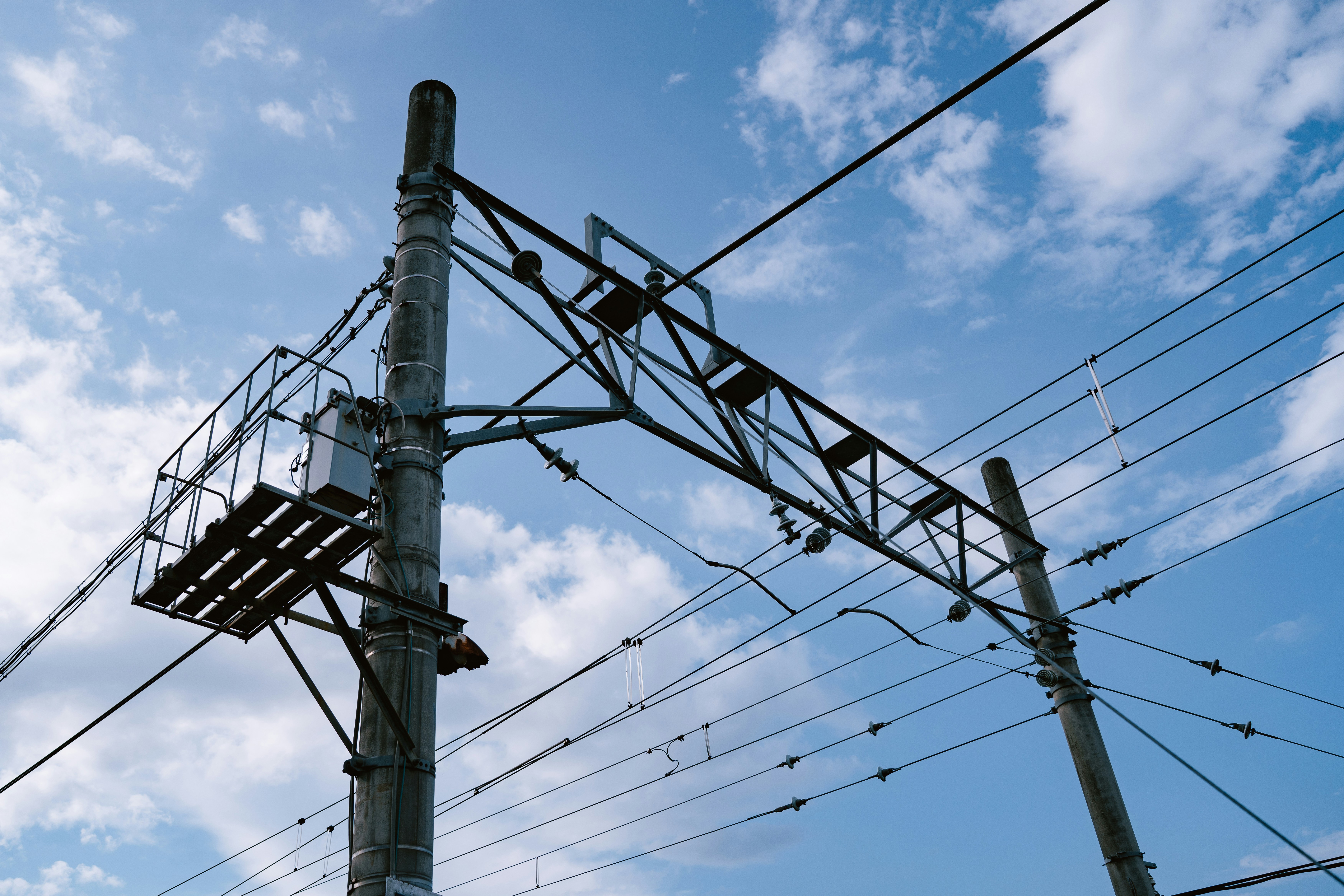 Overhead Rails: Steel Lattice Meets Sky