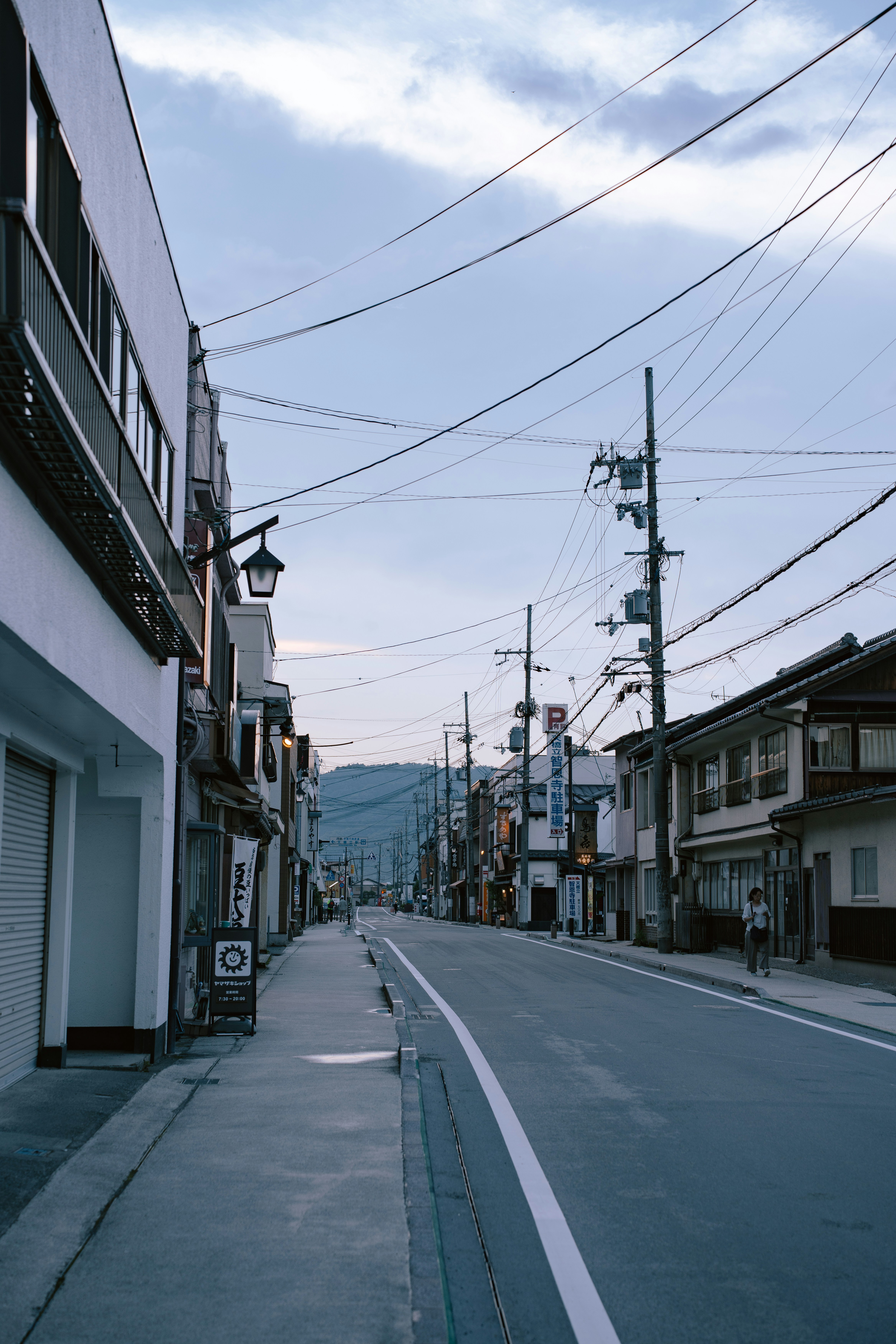 Quiet Street Veiled in Blue: A Moment on a Japanese Town