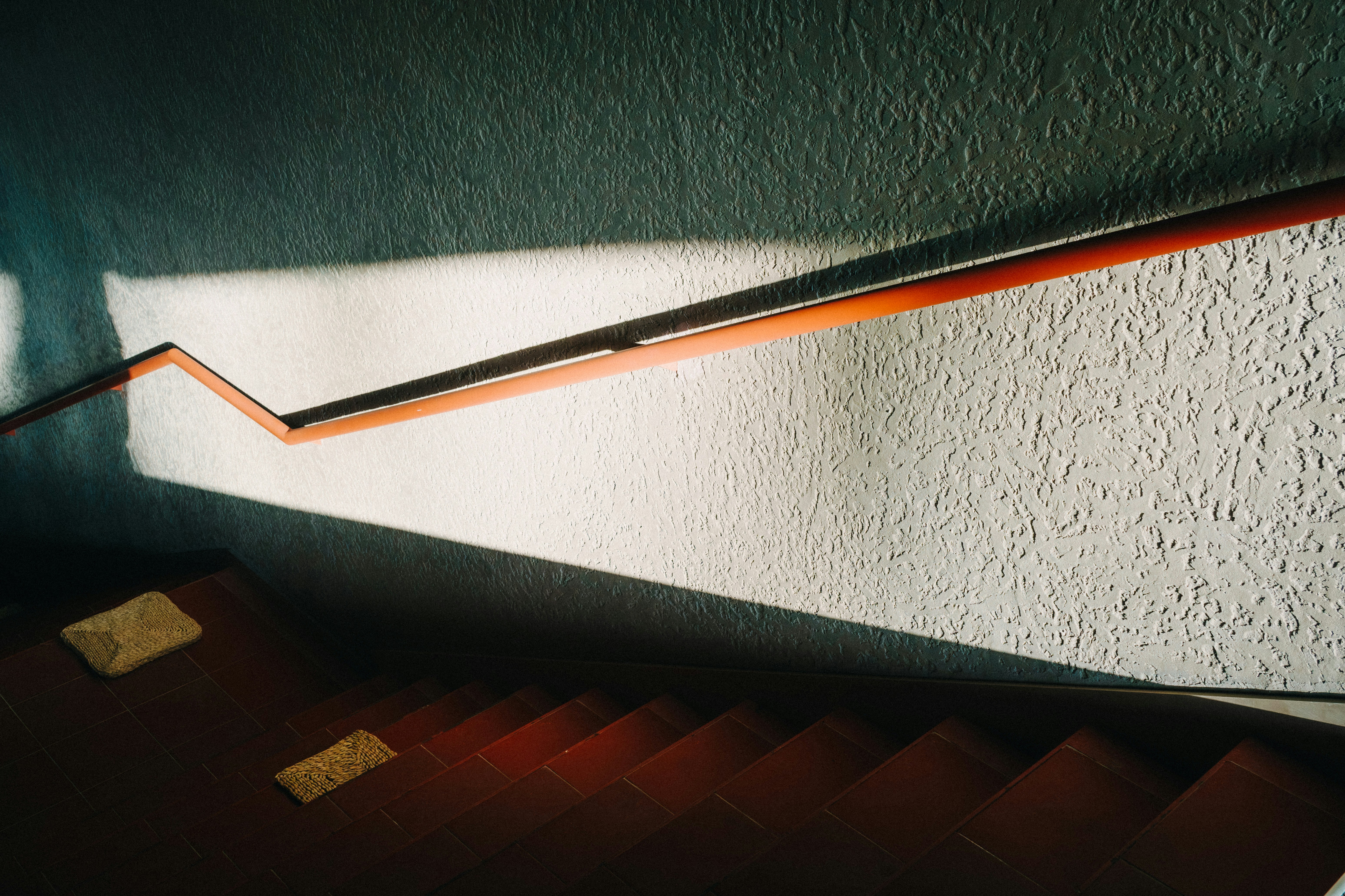 Concrete staircase silhouette under angular railing