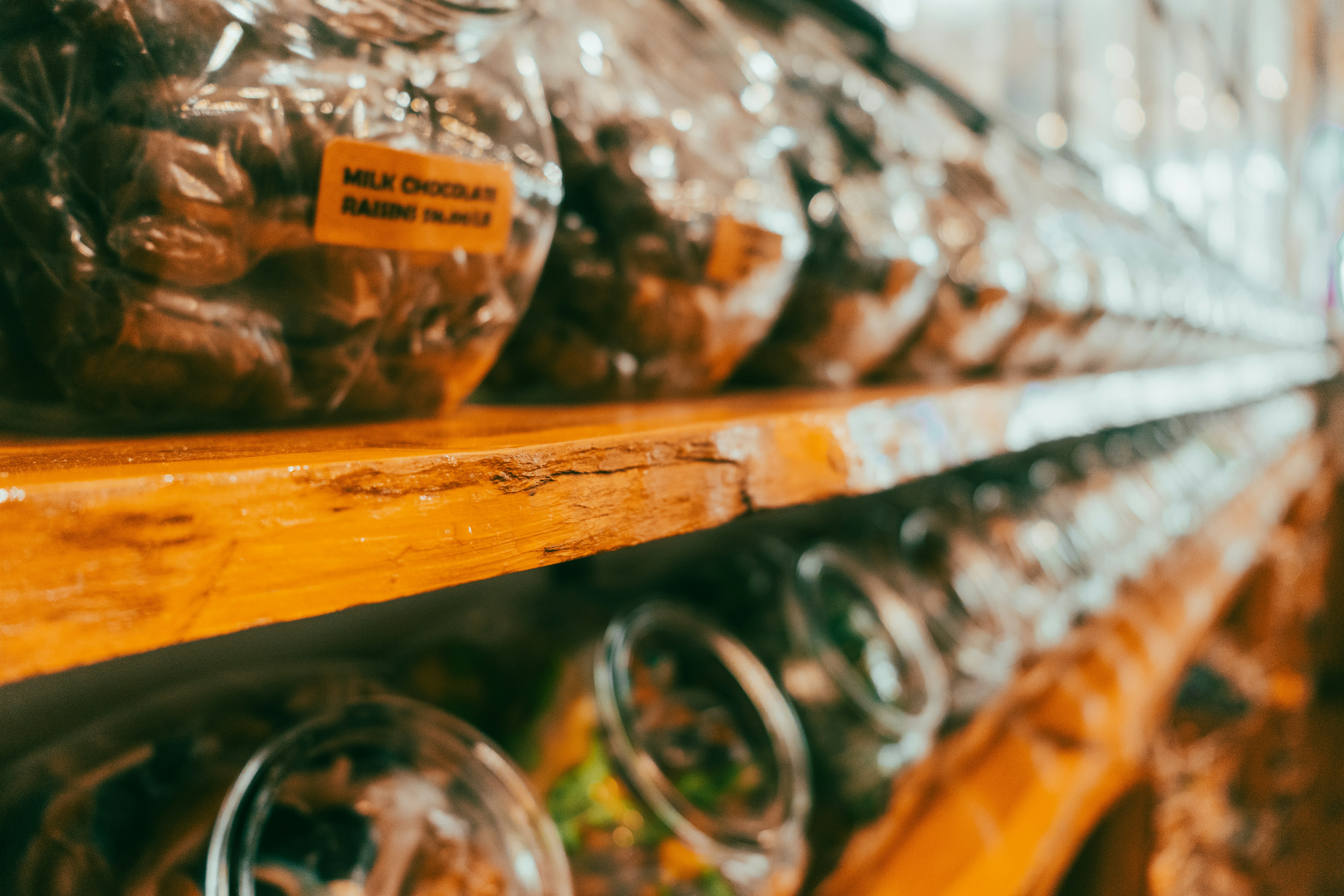 Aisle of Milk Chocolate Delights: Glass Jars on a Warm Shelf