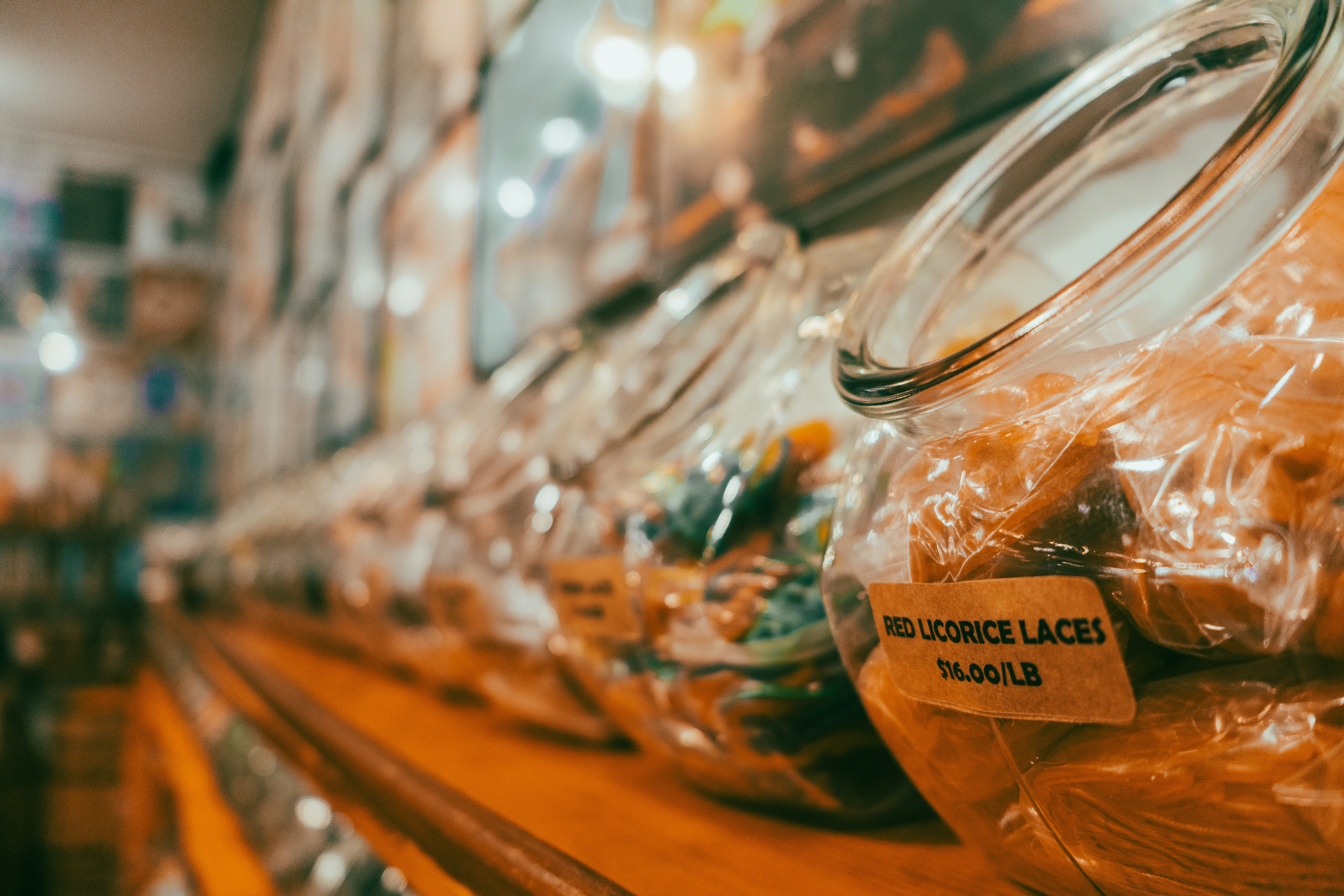 Bagged Candy Jars on a Grocery Shelf Blur to Warm Glow