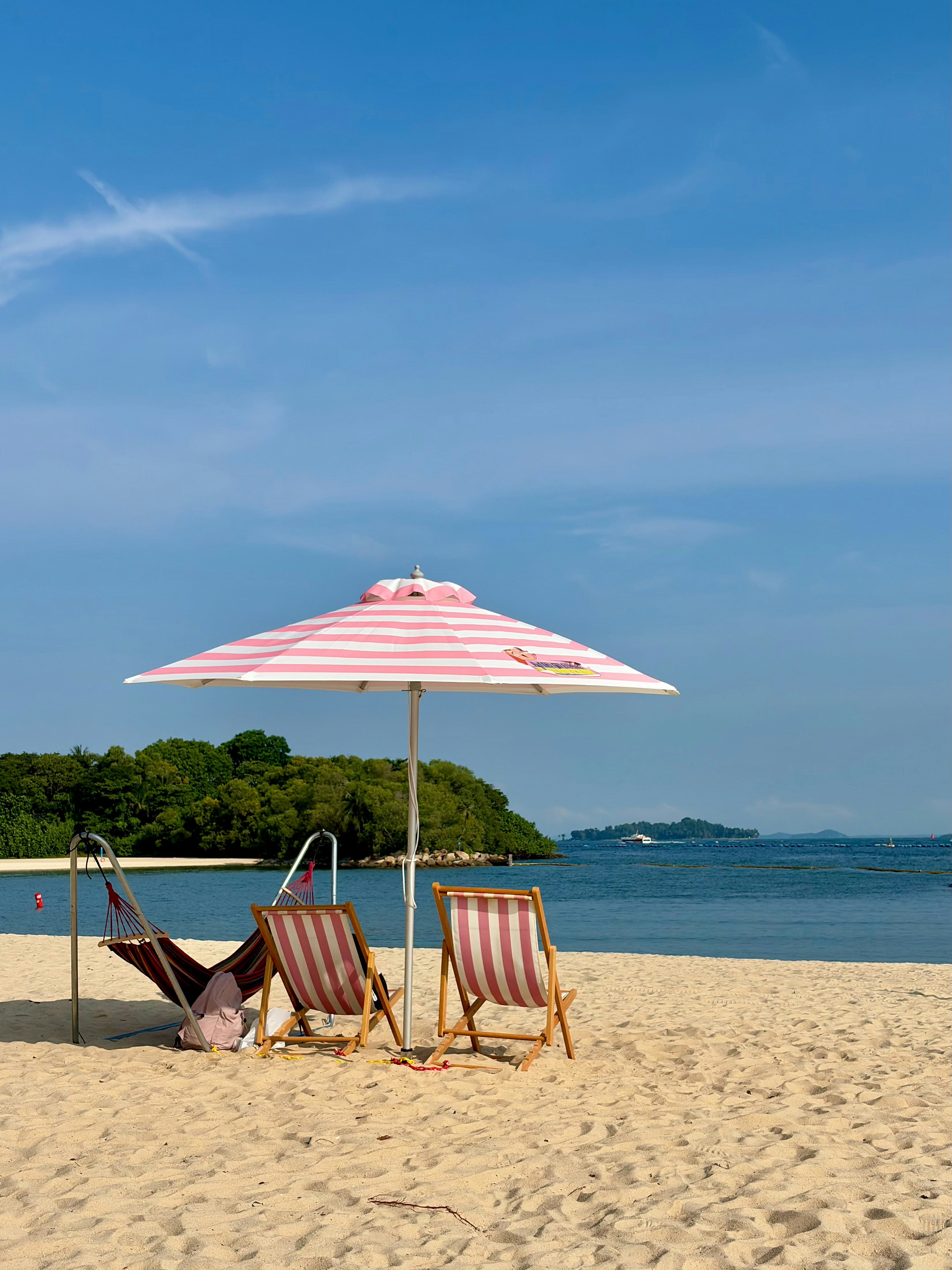 Striped Beach Umbrella Welcomes a Calm Seaside Afternoon