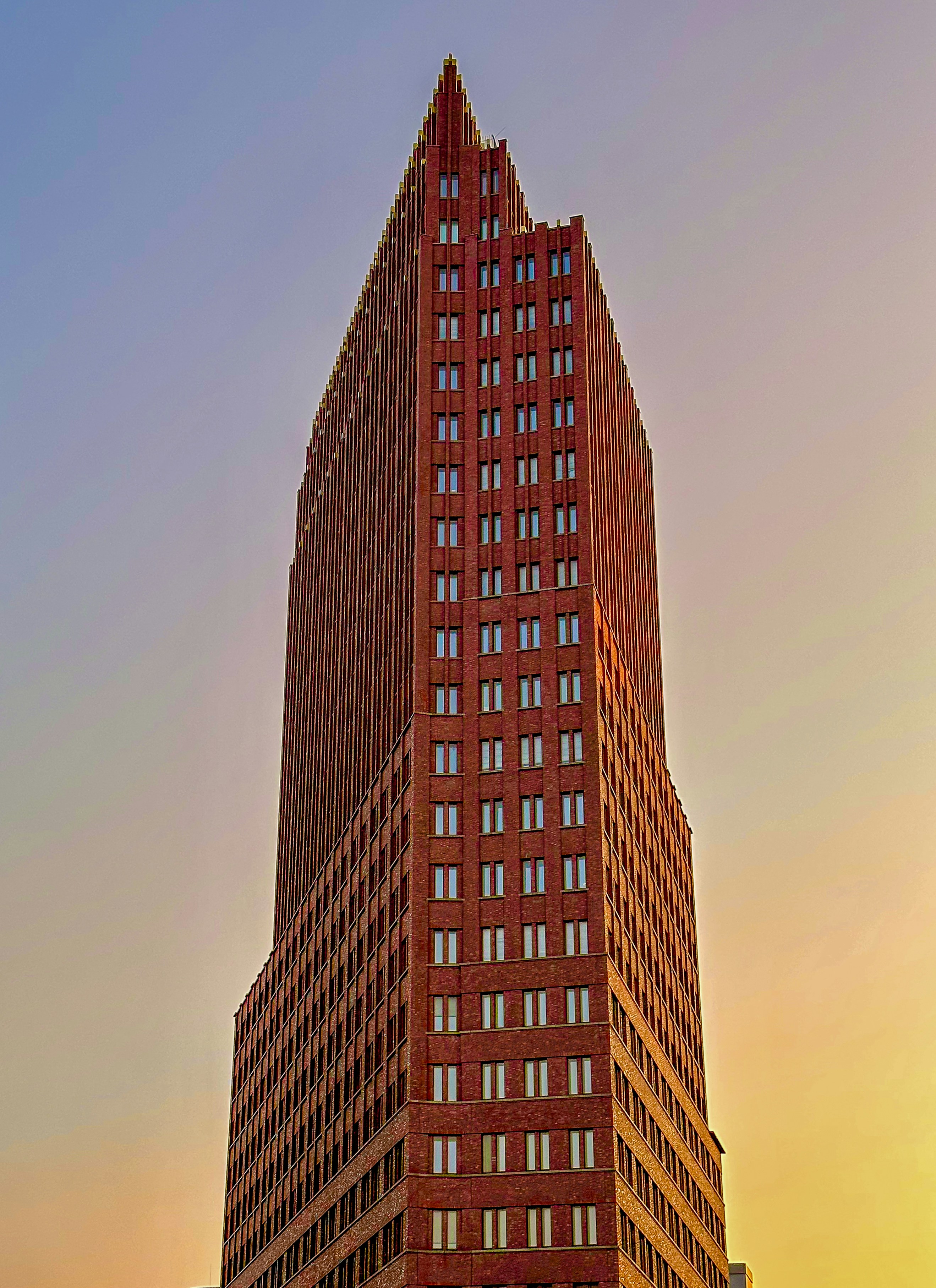 Skyline Pinnacle: A Brick Tower Reaching Toward the Sunset