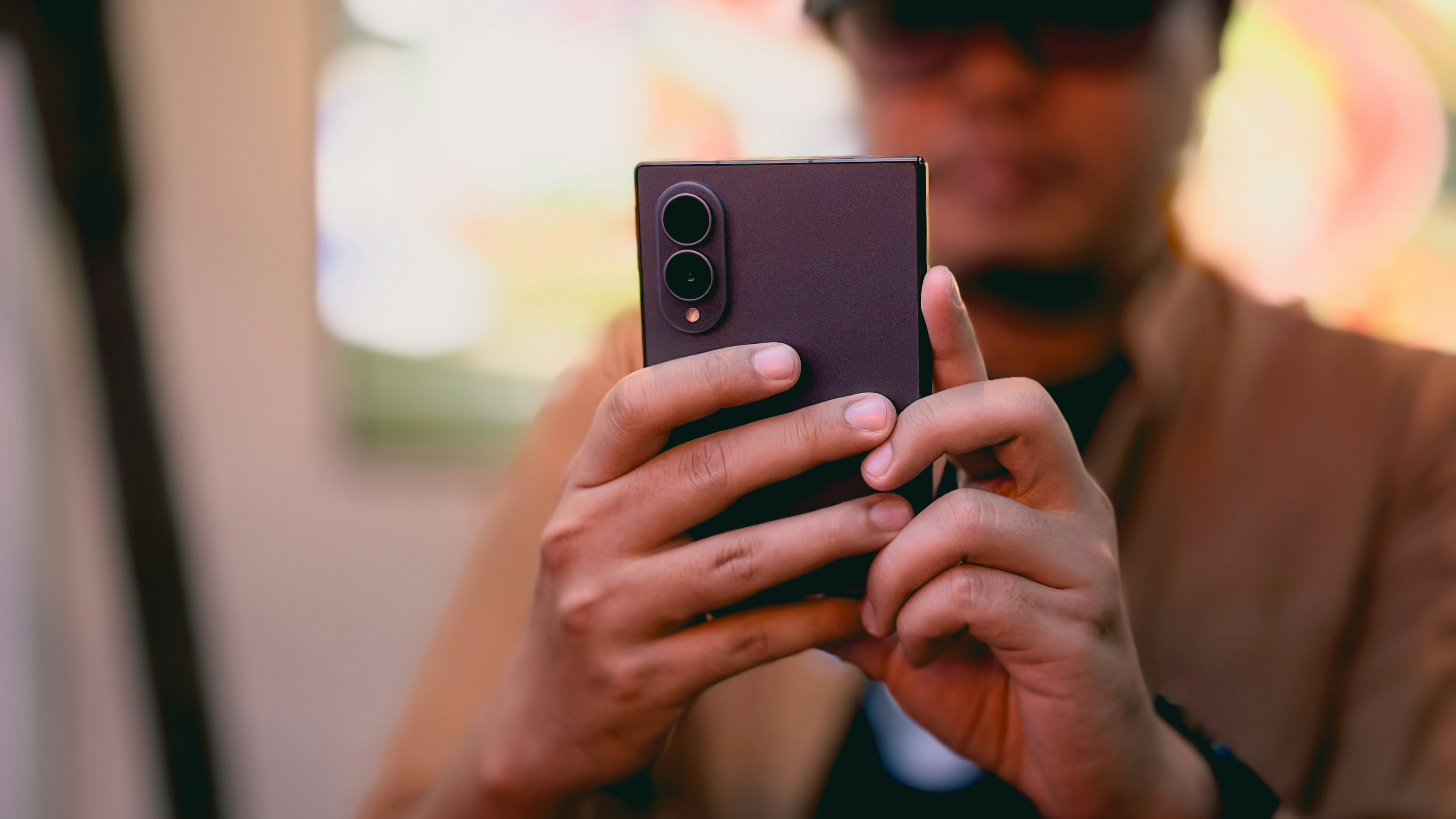 Focused in the Frame: A Portrait of a Person with a Handheld Phone