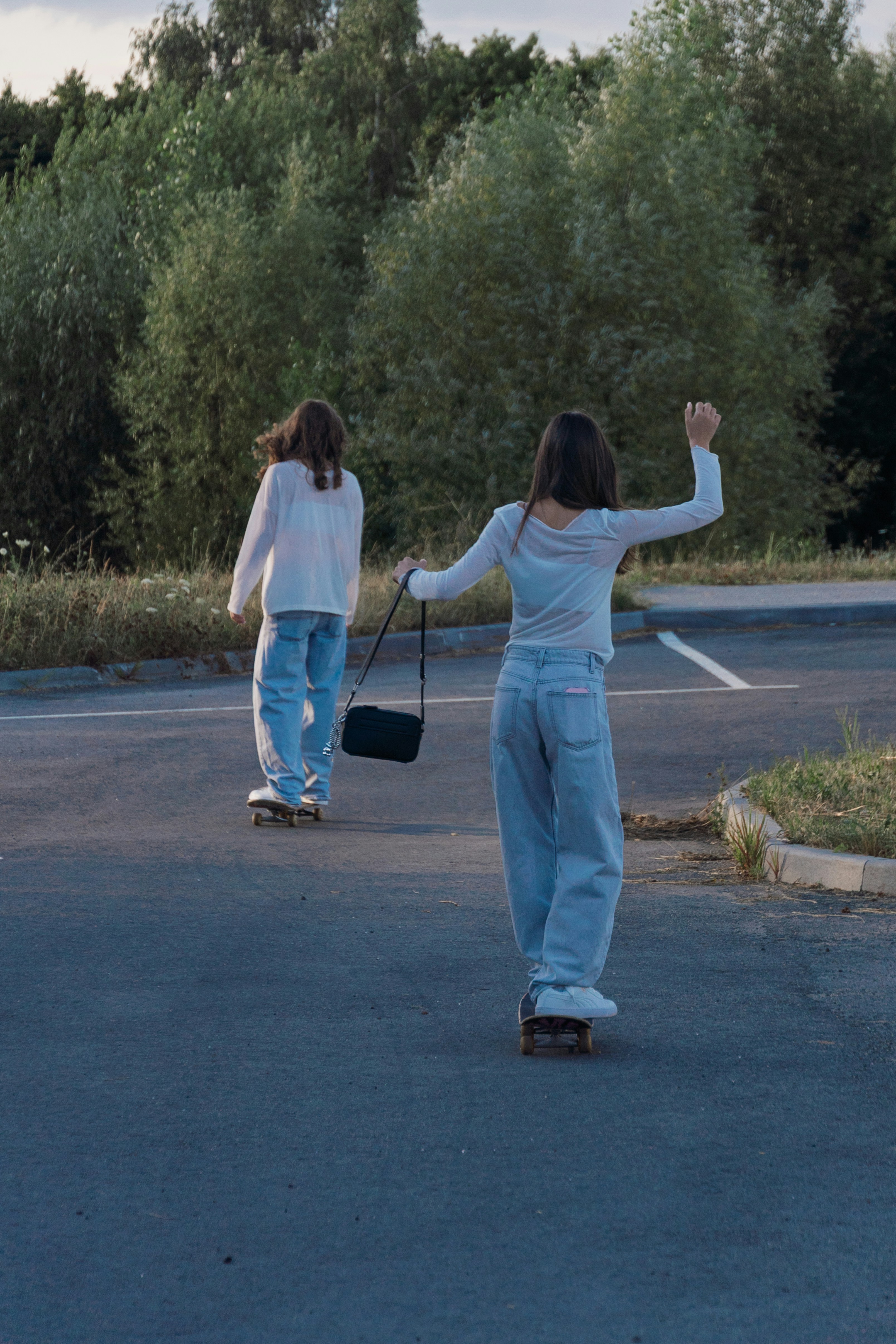 Stride and Shadows: Dual Skaters Conquer the Quiet Lot