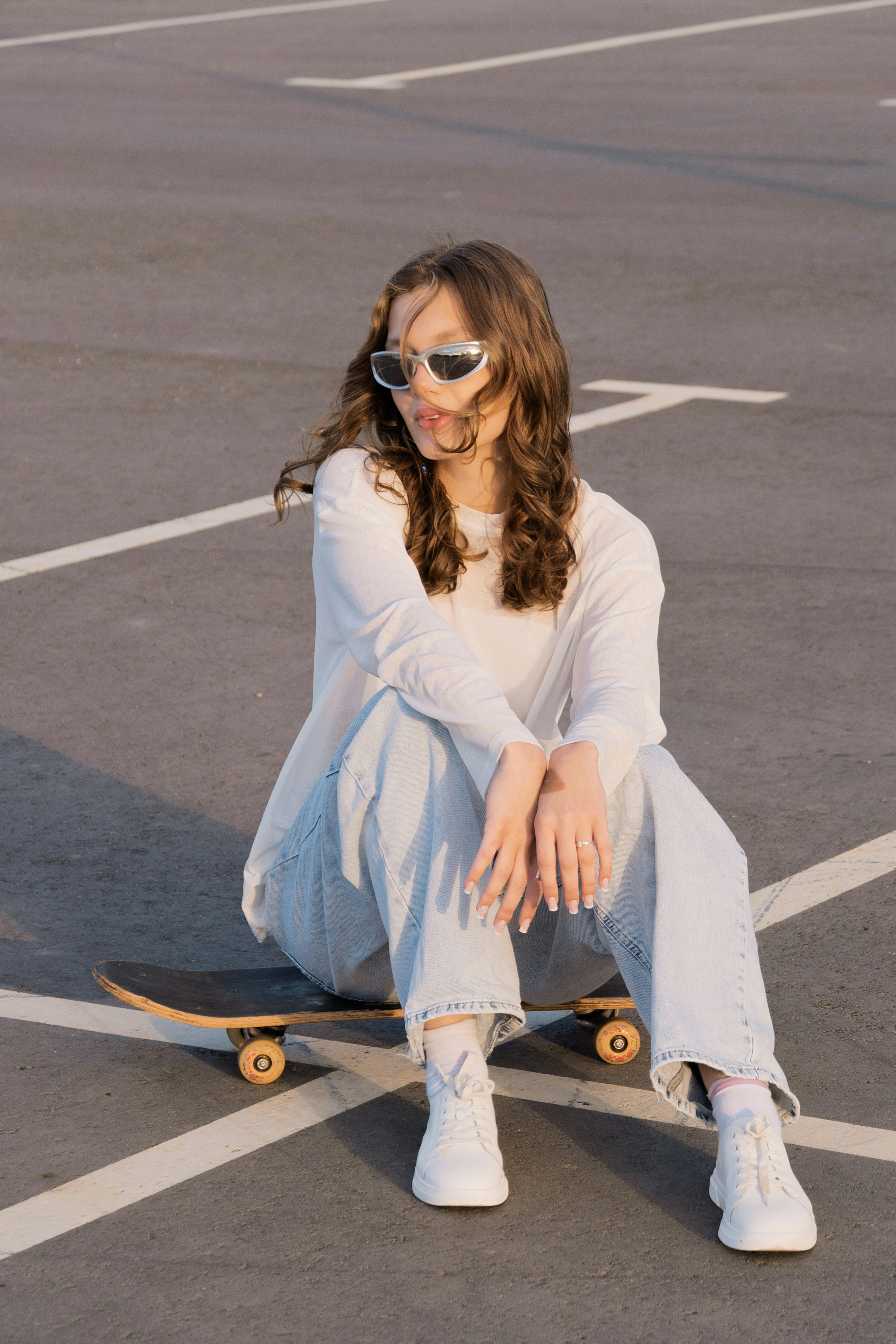 Skateboard Quiet: A Sunset Pose in an Empty Lot