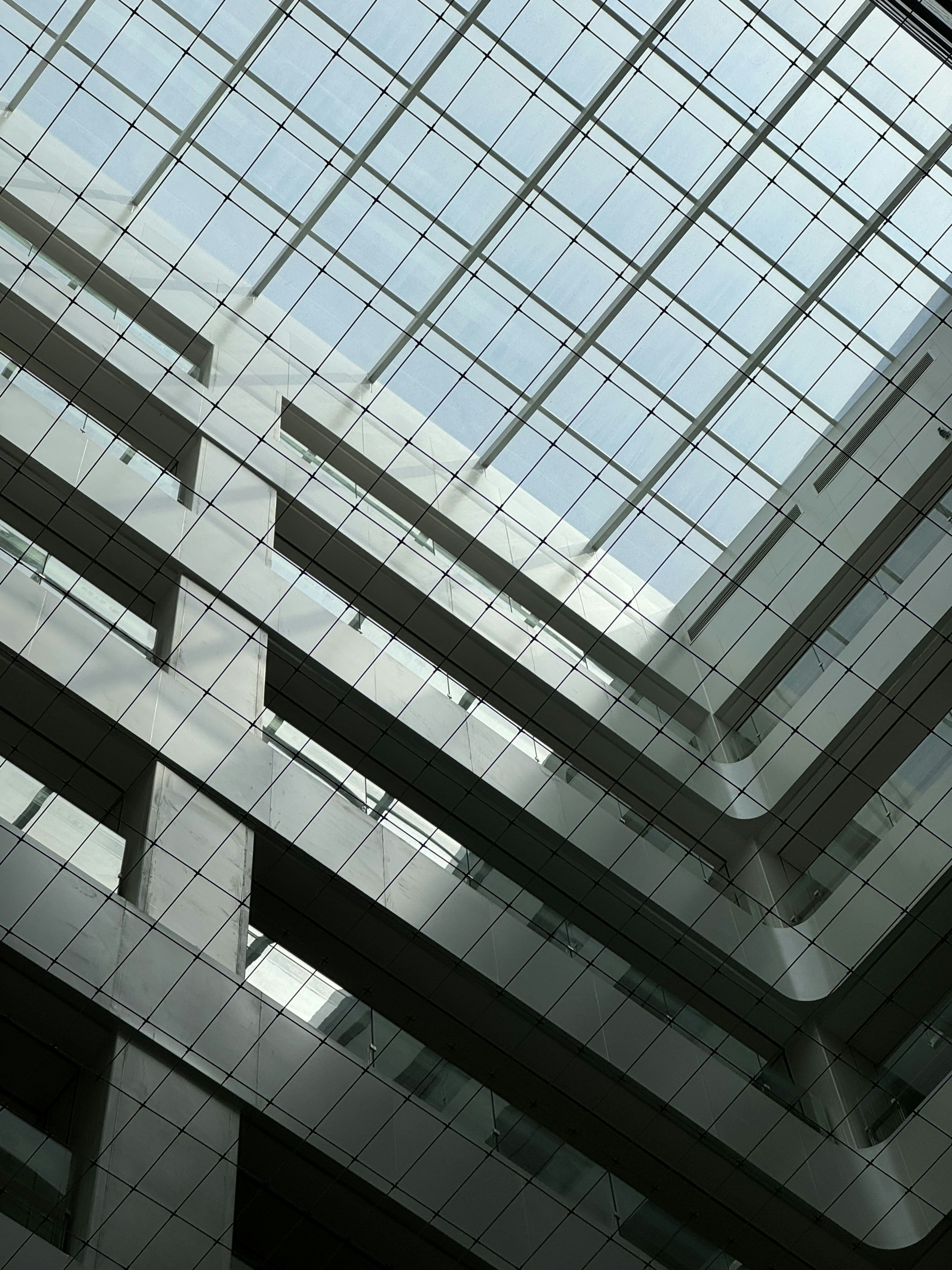 Glass Cathedral: Interwoven Horizons in a Skyward Atrium