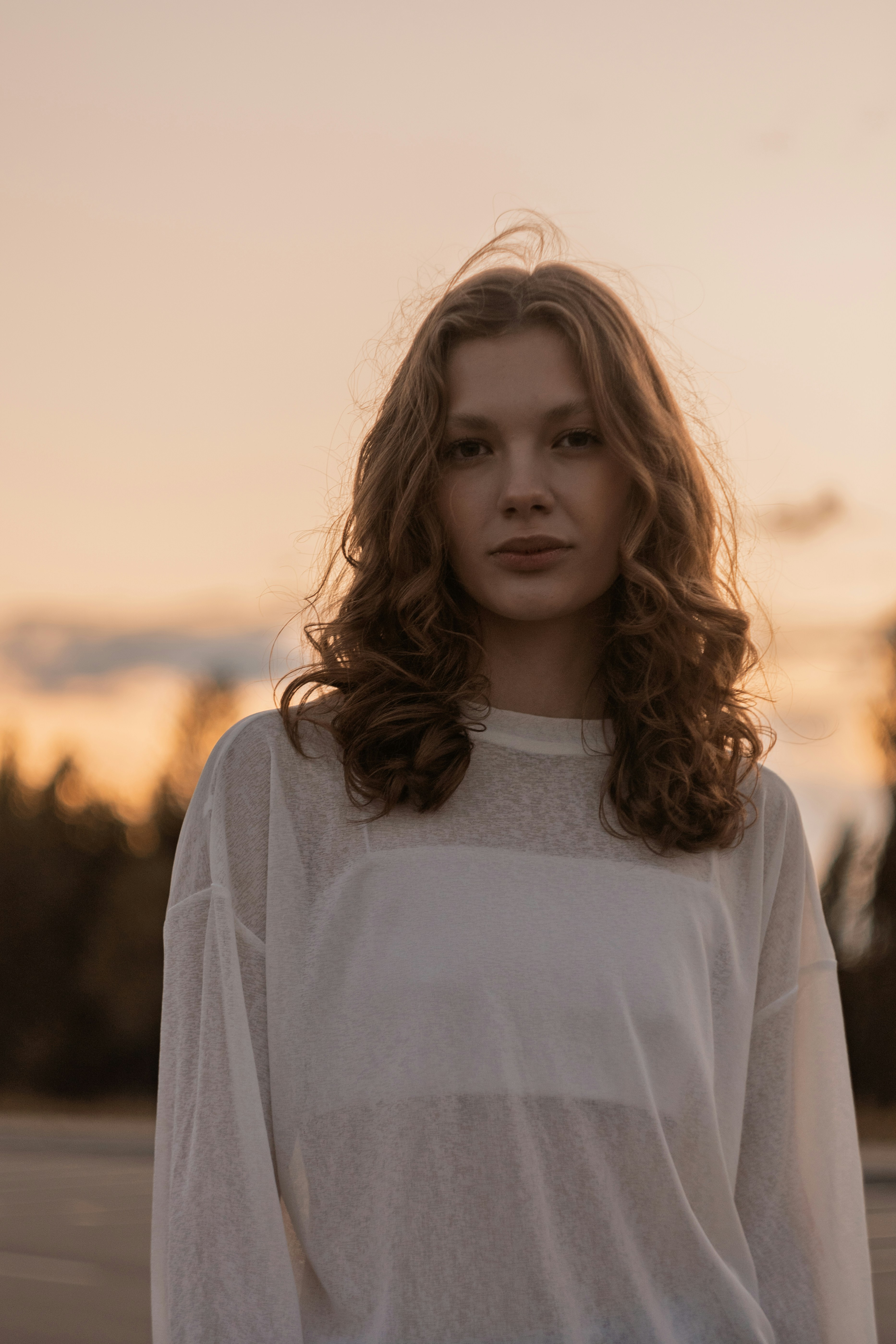 Soft Horizon Portrait: Warm Light on a Quiet Gaze