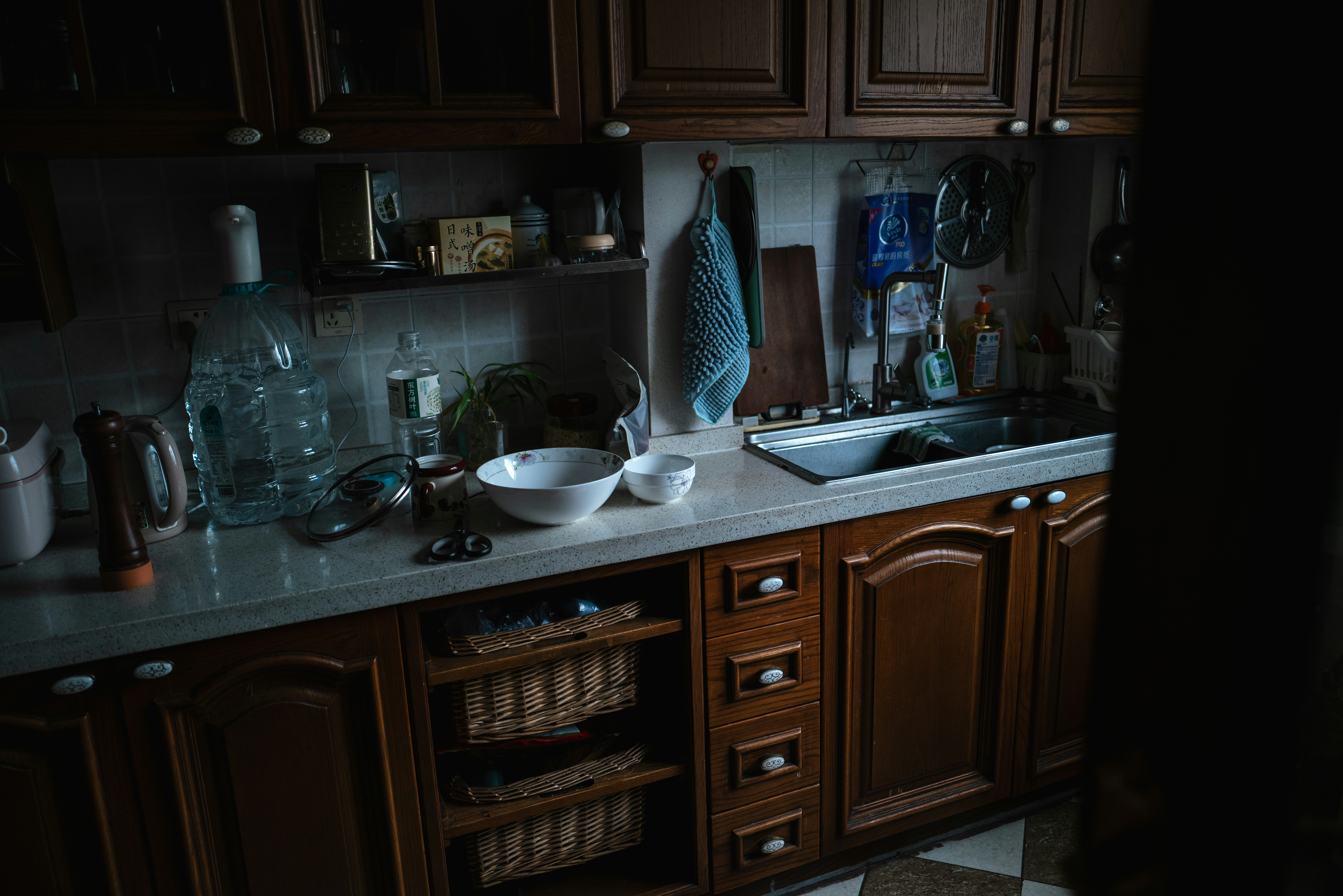 Dim Kitchen After Hours: A Quiet Countertop Landscape