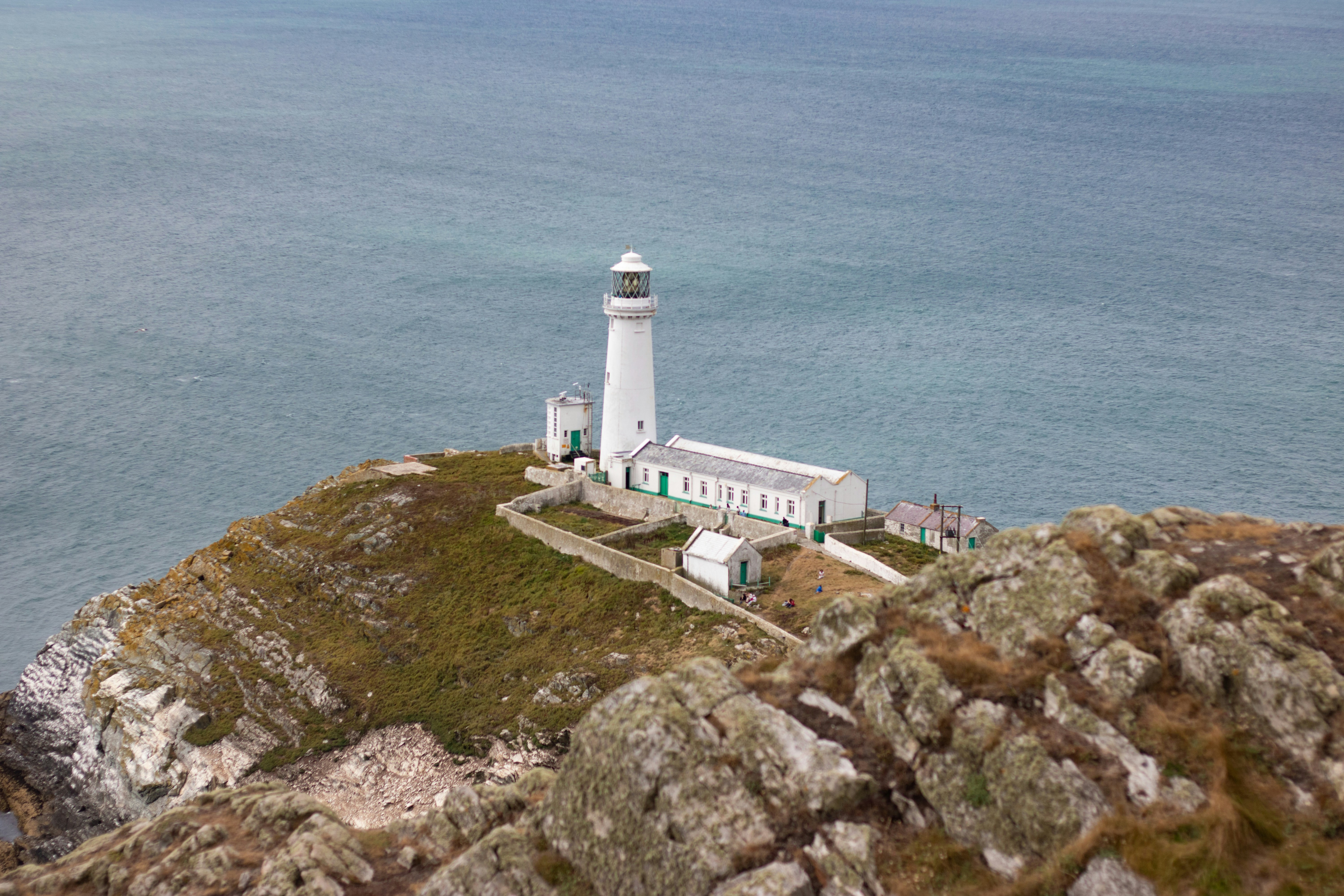 Cliffside Beacon: A solitary lighthouse gazing over the sea