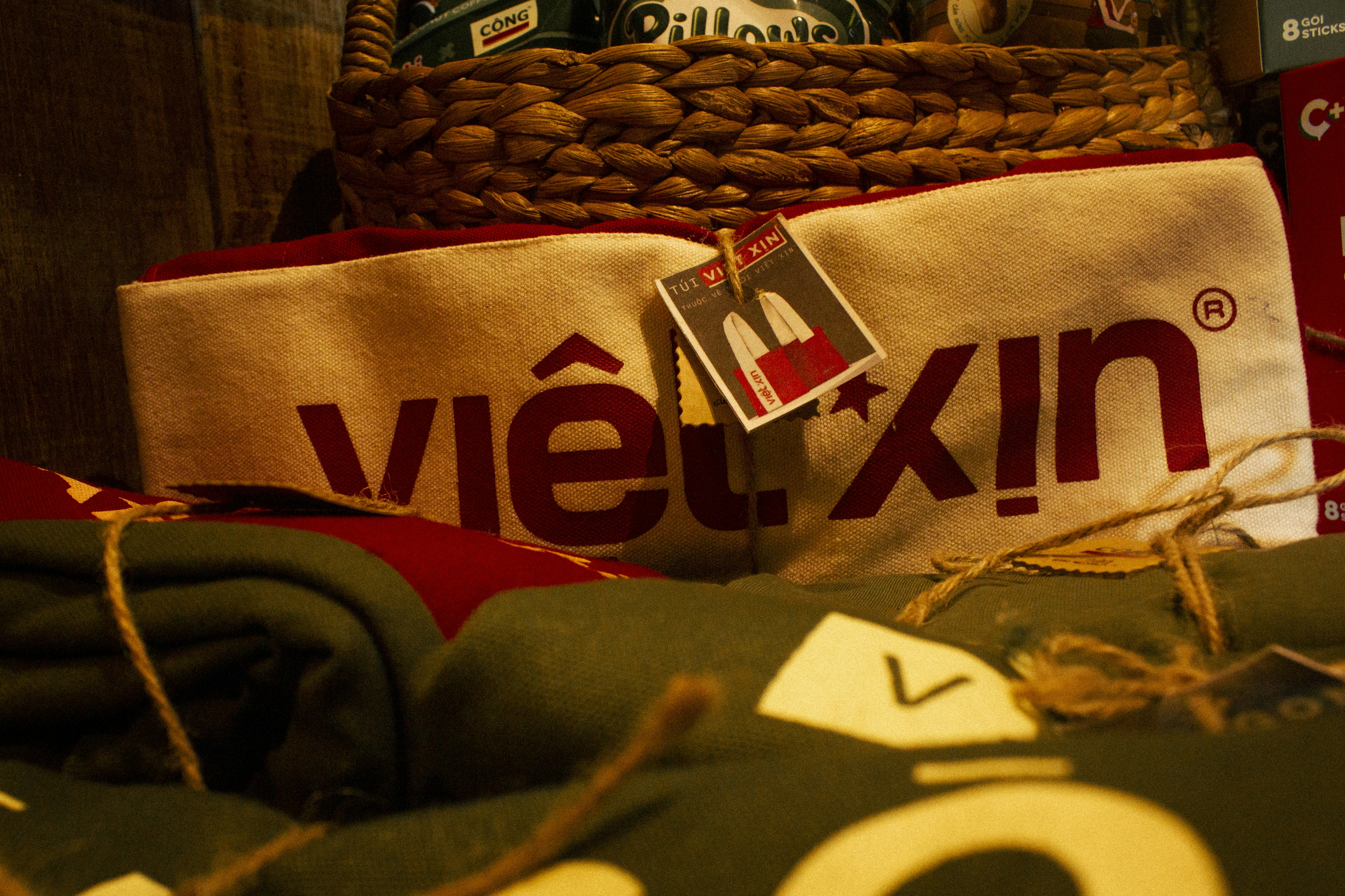 Warm Boutique Still Life: Folded Textiles and a Gift Tag