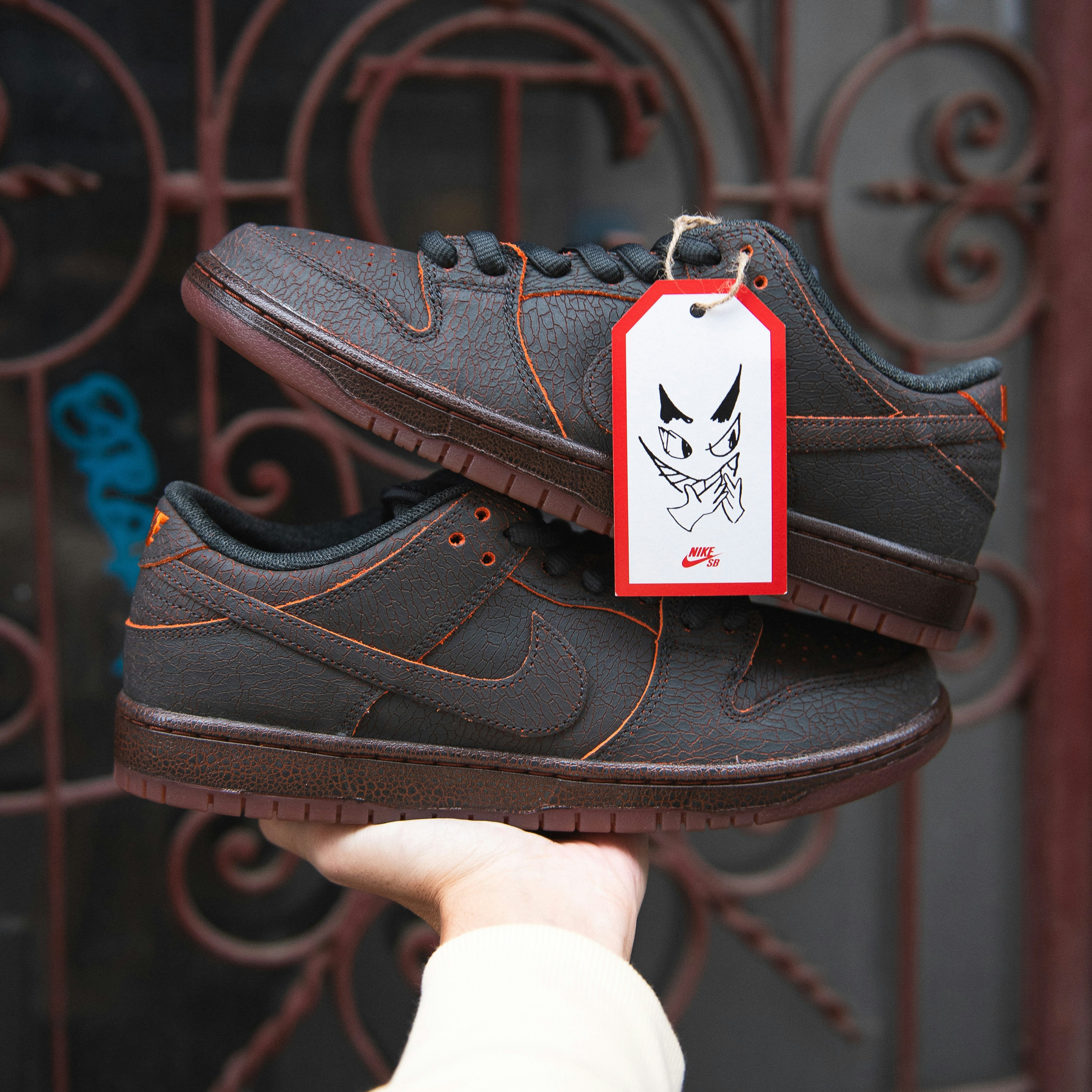 Balanced Sole: A Pair of Nike Dunk Lowes Resting on a Hand-Prop Corner