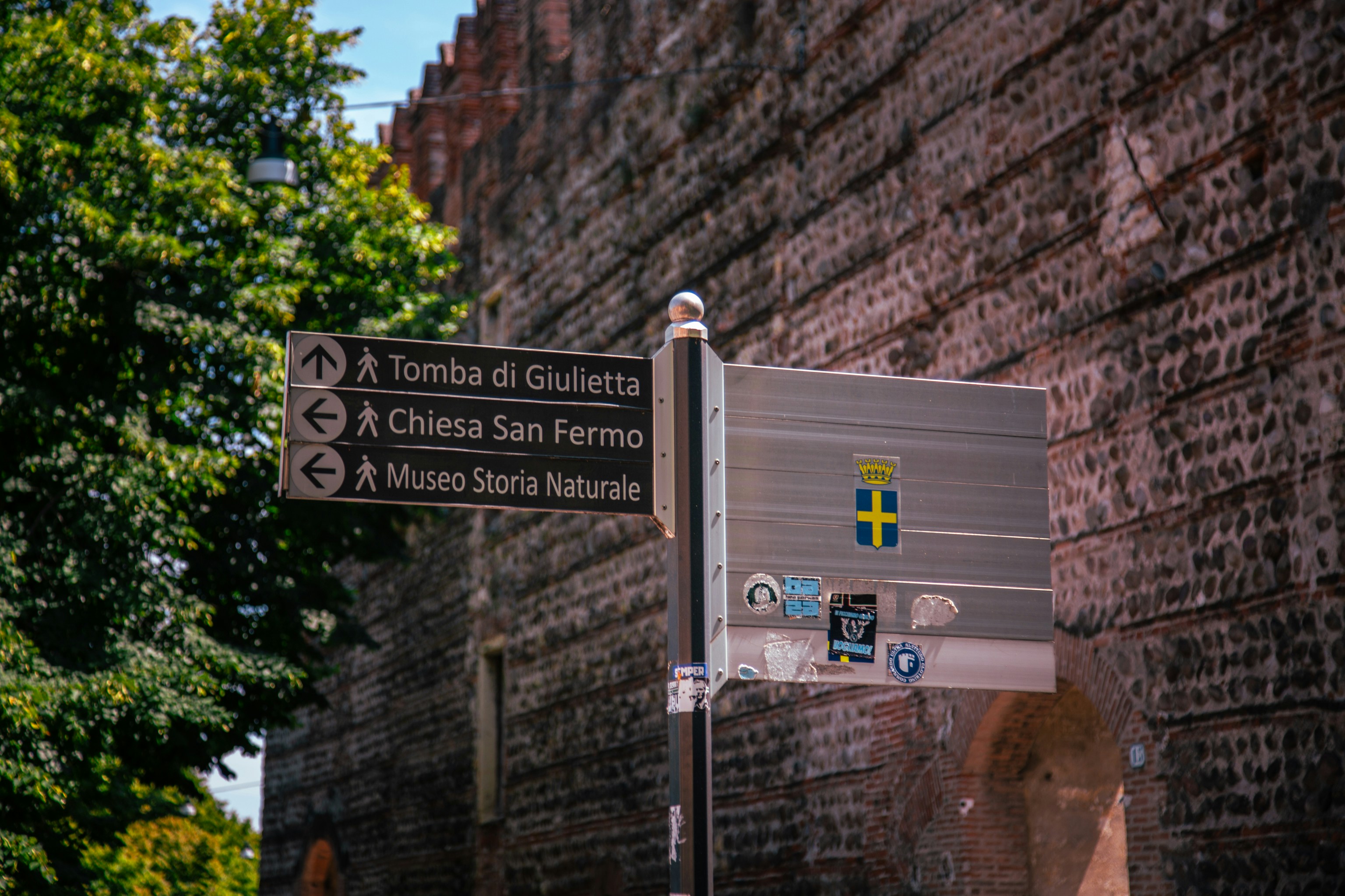 Stone Signpost at a Historic City Gate