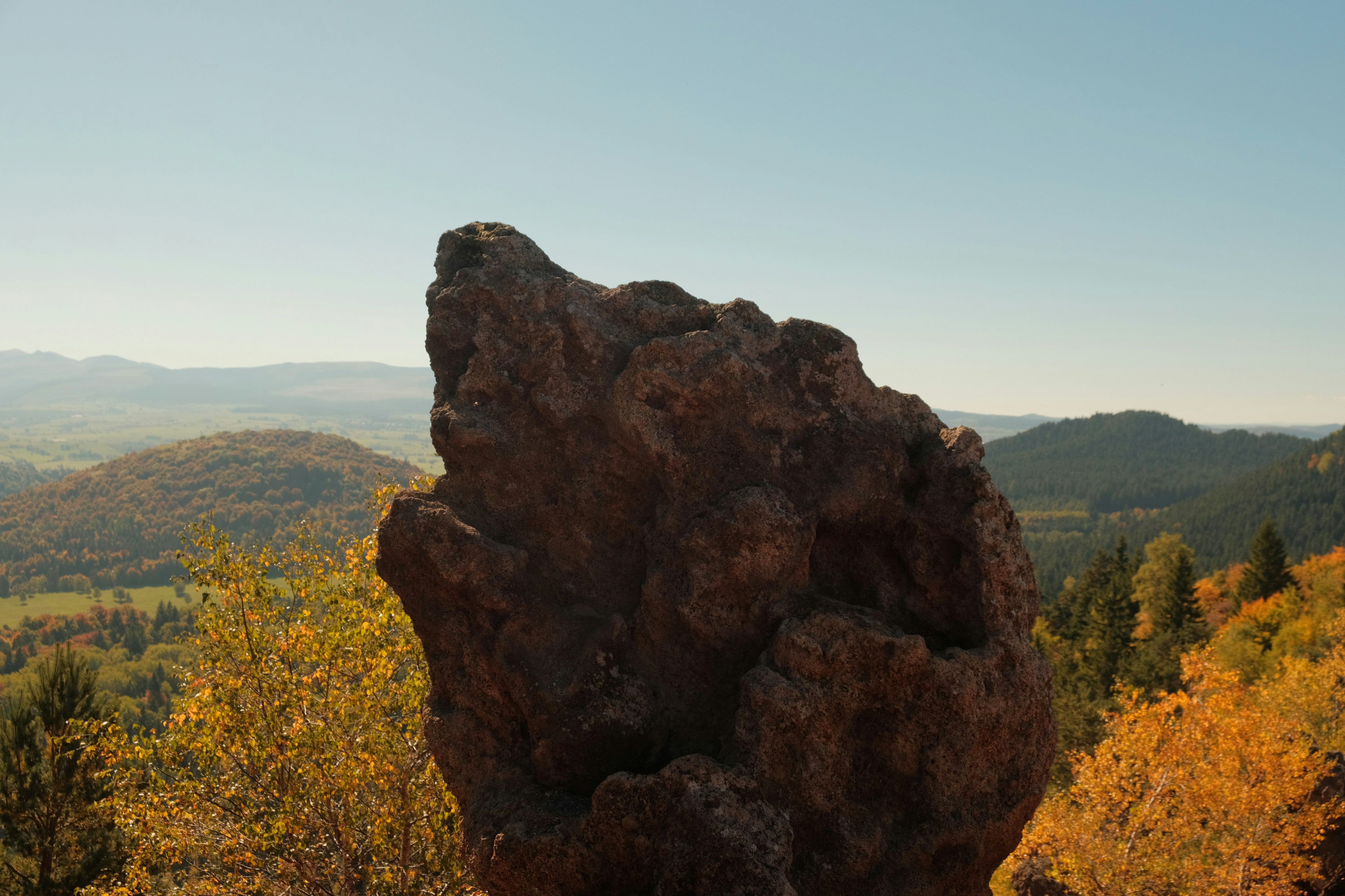 Stone Sentinel Rising Over Autumn Valleys