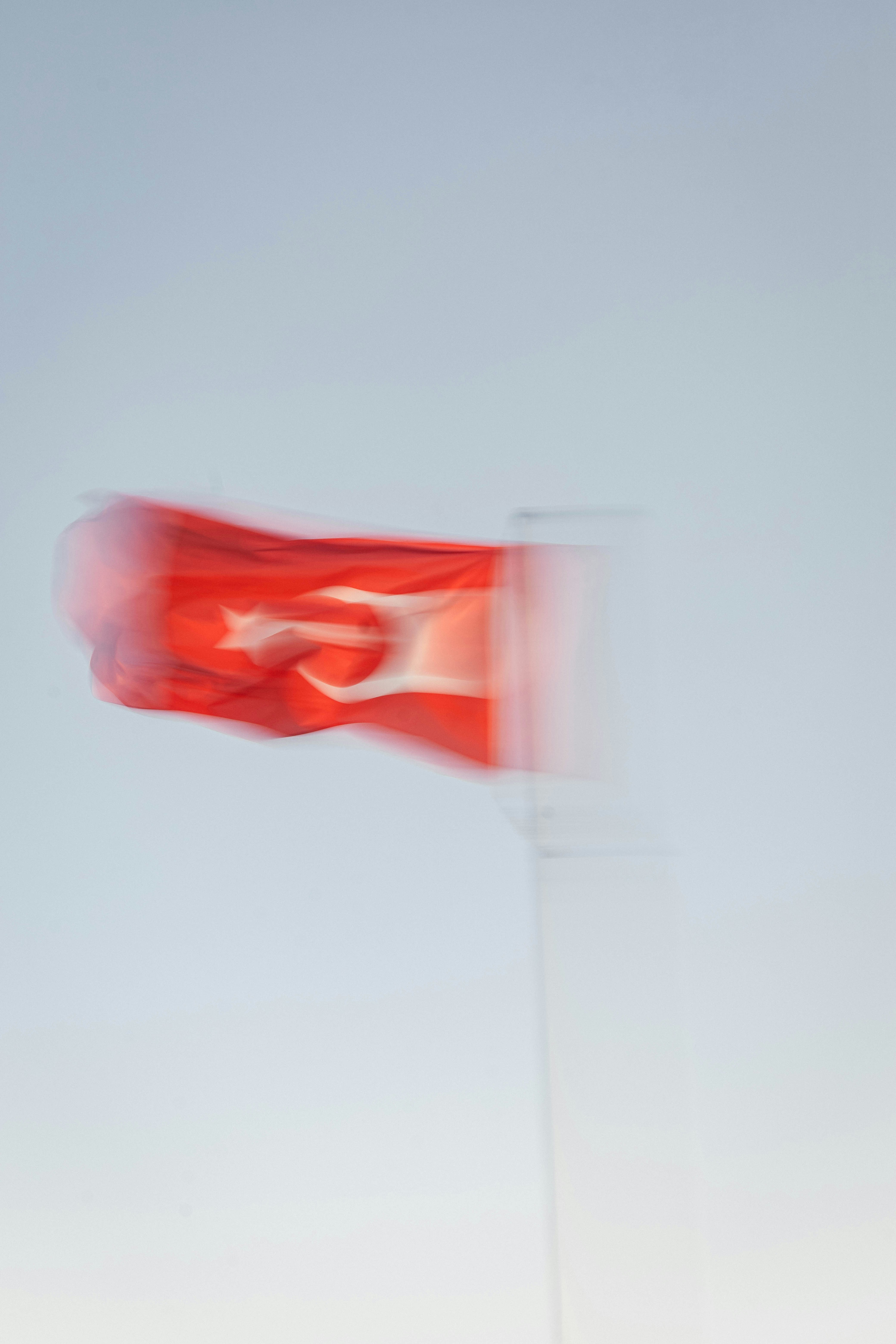 Turkish Flag in Motion — Soft Blur, Quiet Sky