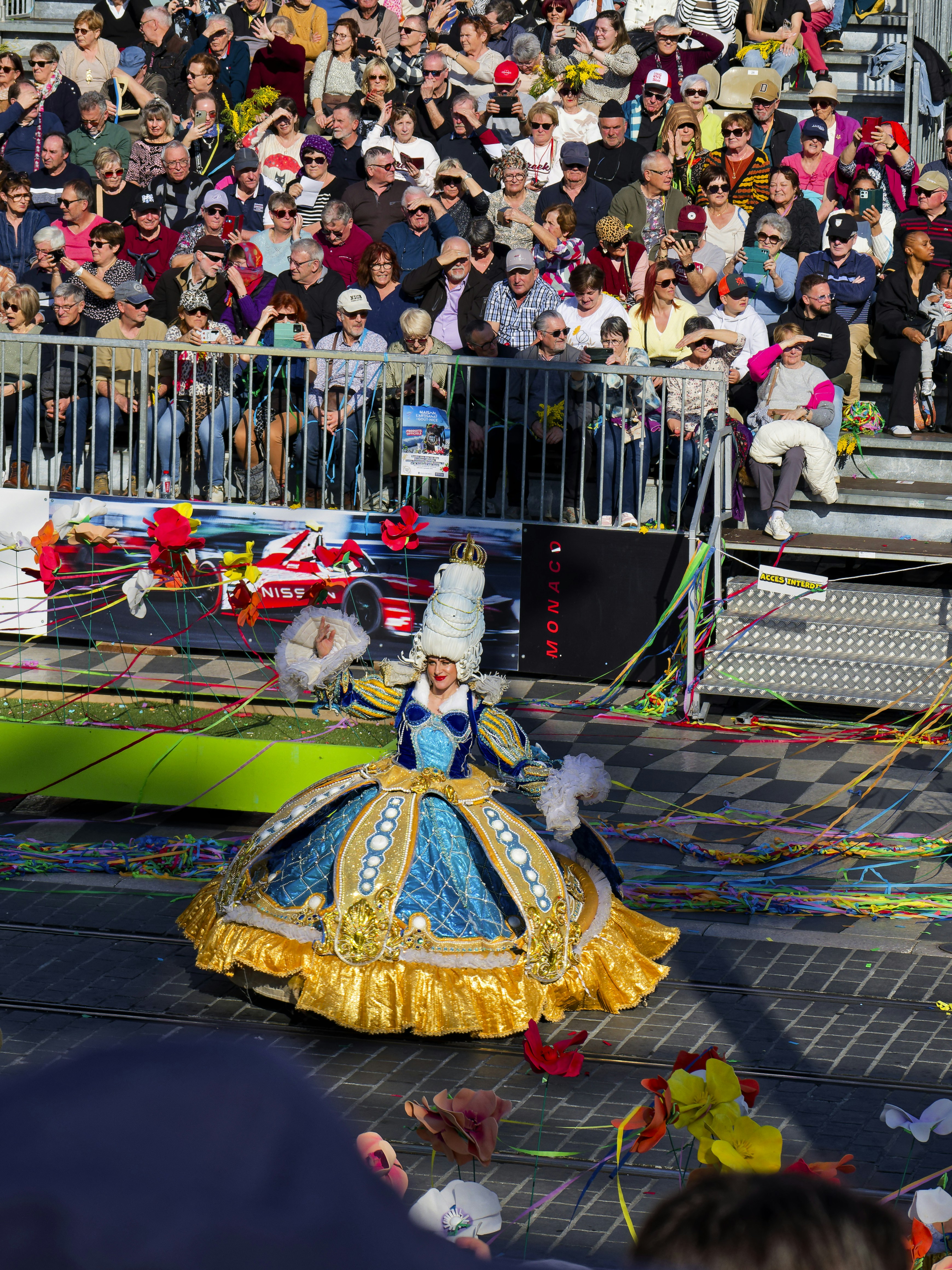Carnival Queen in a Gold-and-Blue Ballgown Reigns Over the Parade Floor