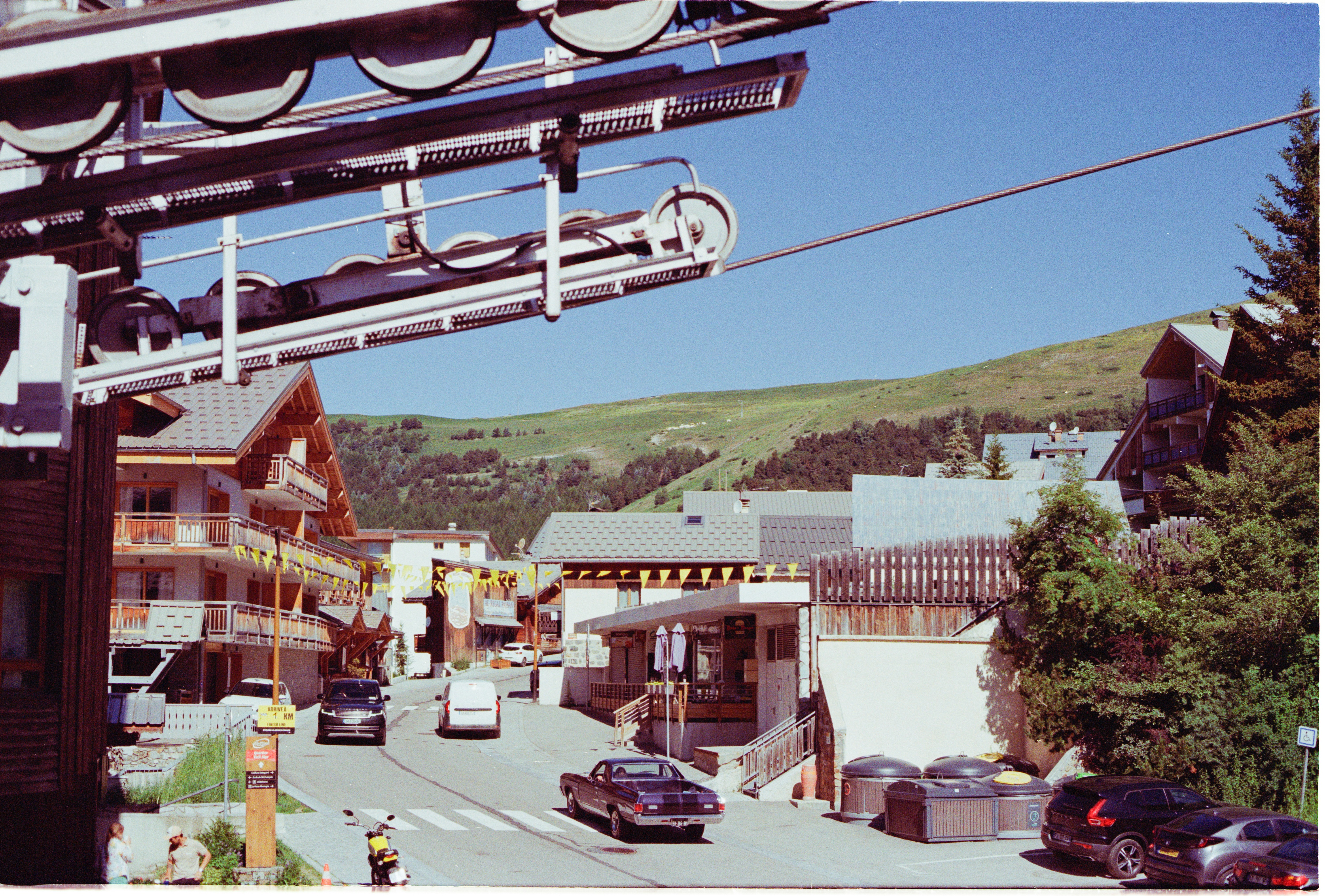 A Mountain Village Street Framed by Cable Infrastructure