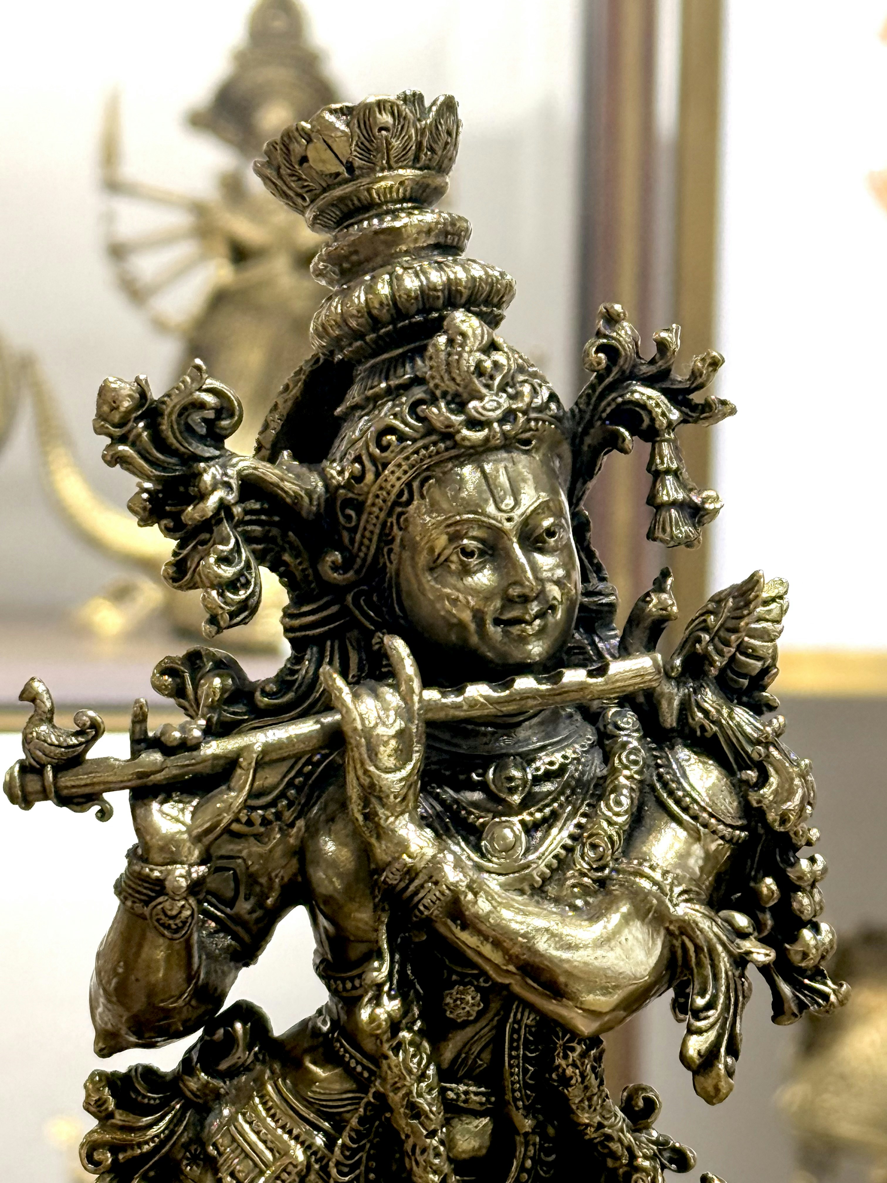 Bronze Hindu Nanak Sculpture: Flute-Flight Amid Ornate Carvings