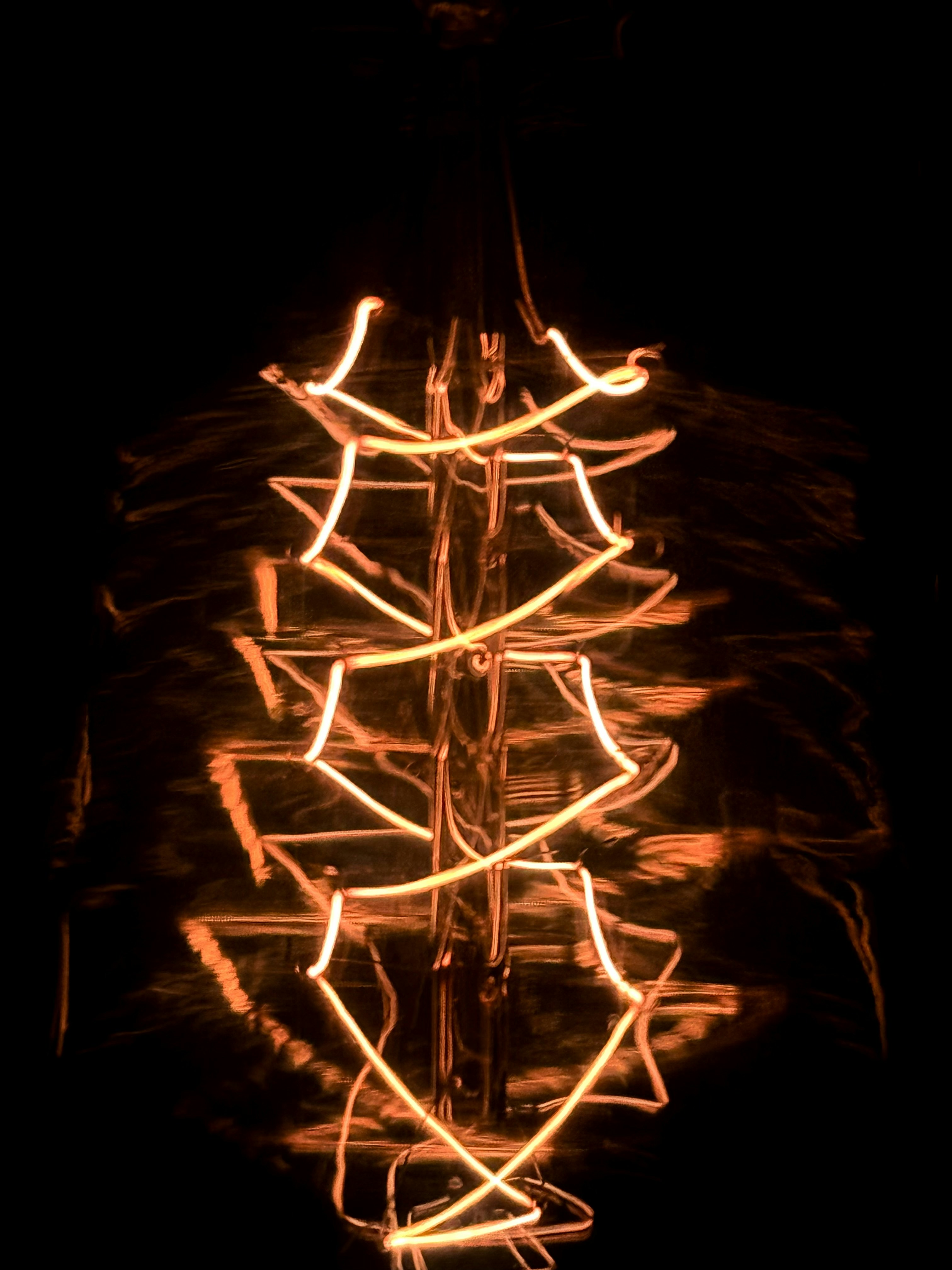 Neon Helix: a warm glow of geometric light in darkness