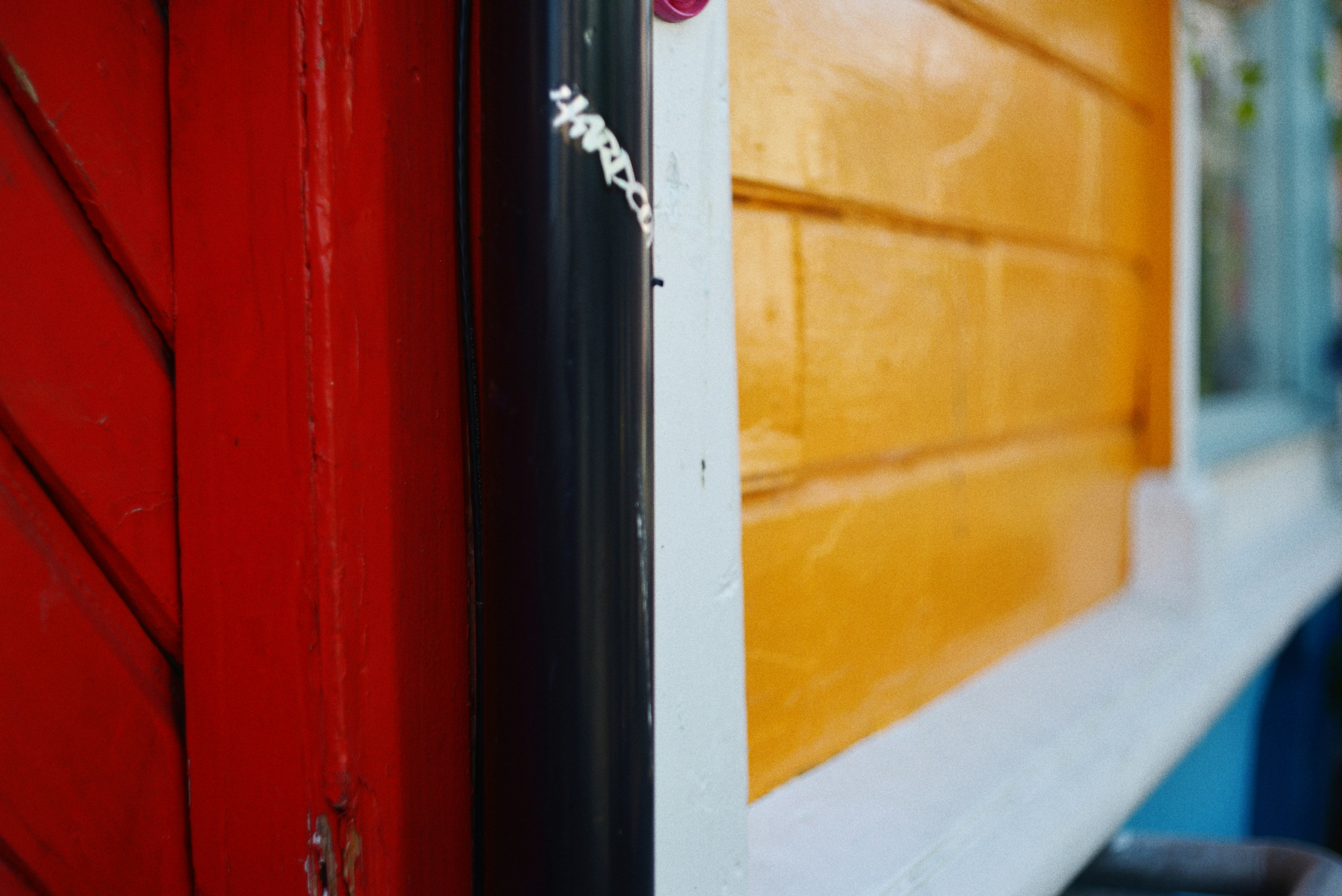 Colorful doorway in a sunlit alleyway