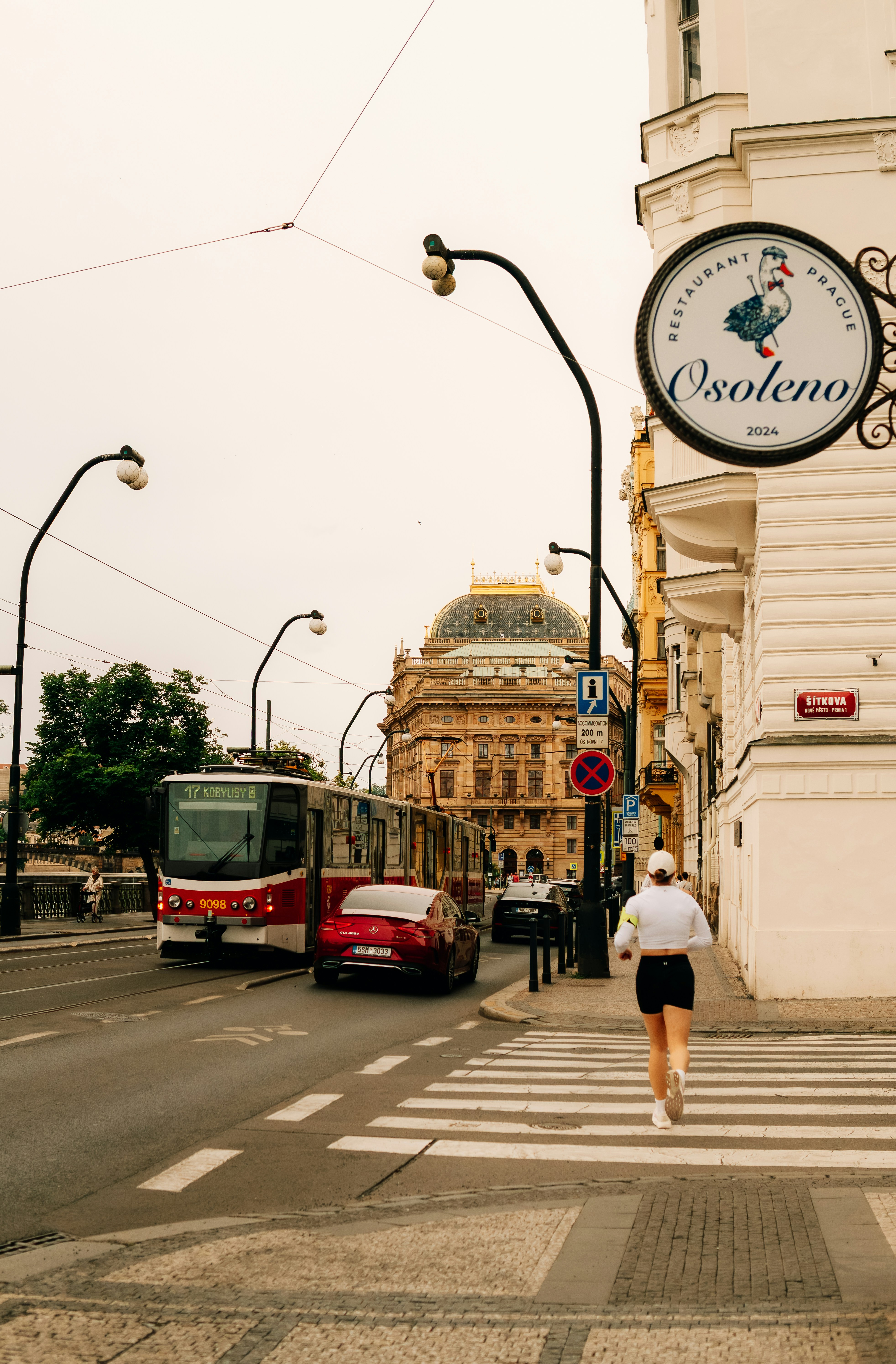 Pedestrian Crossing Beneath Urban Arcades