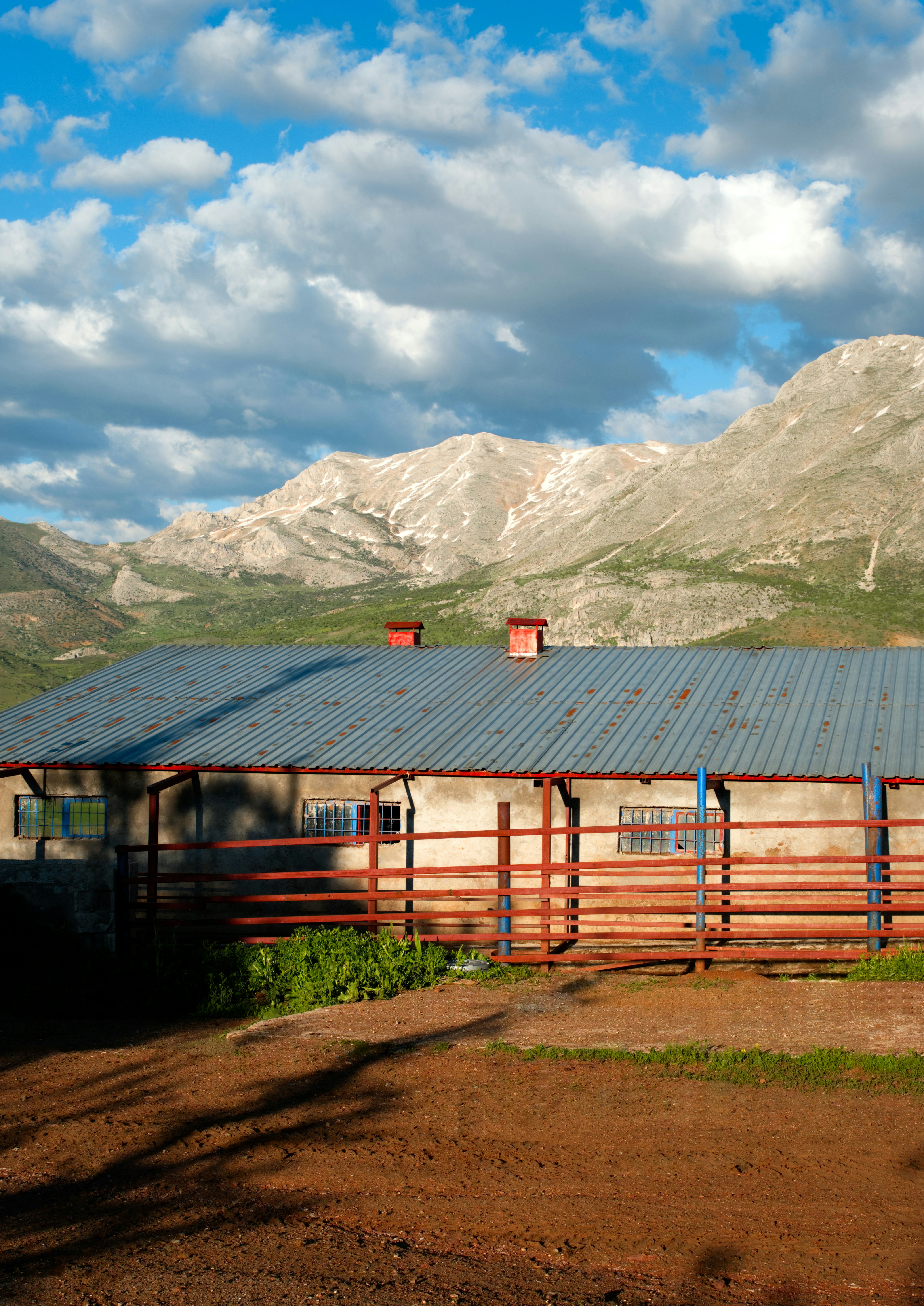 Ridge and Roof: A rural scene under summer skies