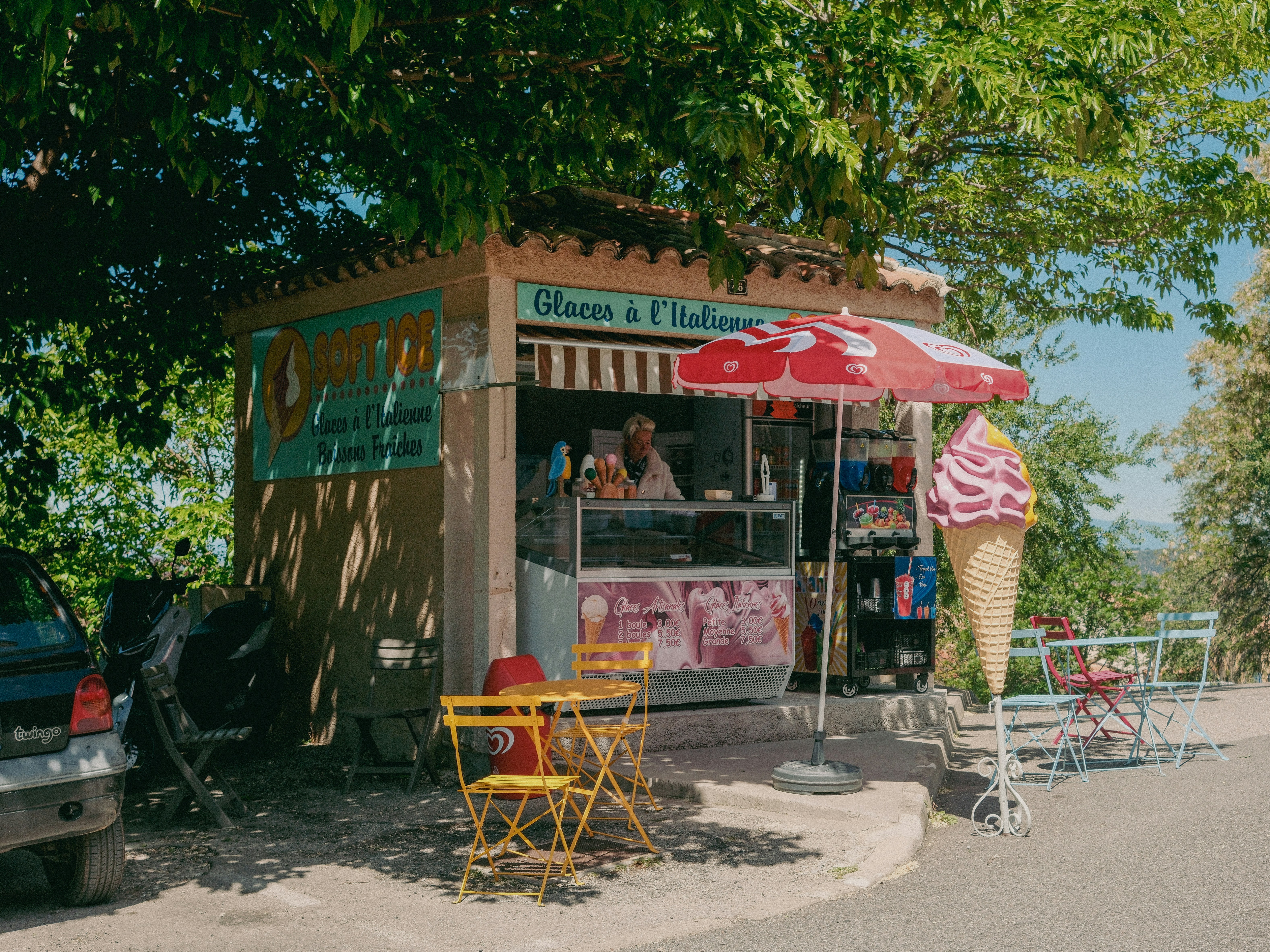 Ice Cream Stand in Shade: Summer Corner with Pink Cone Sign