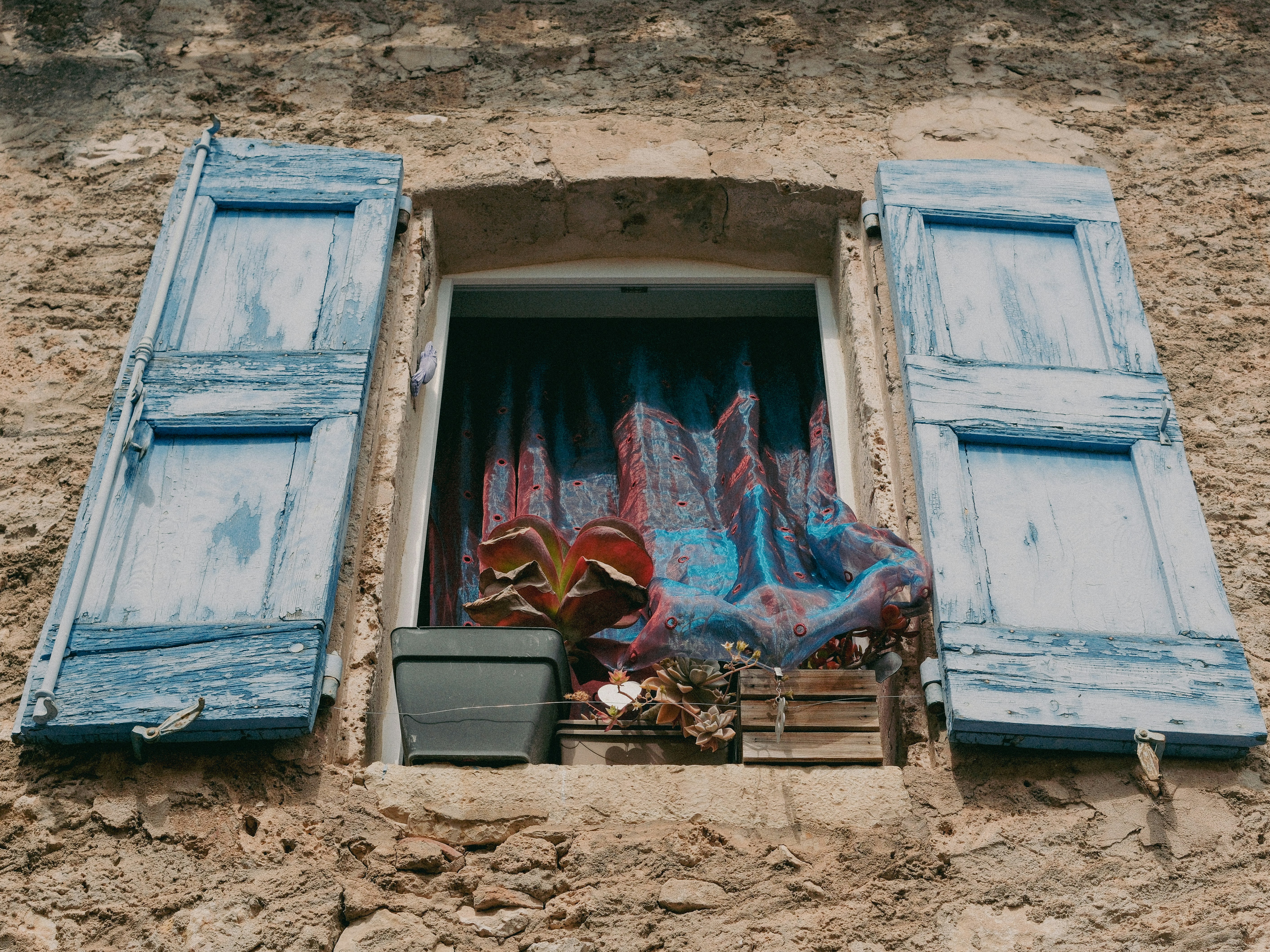 Weathered Blues: Open Window with Tattered Curtain