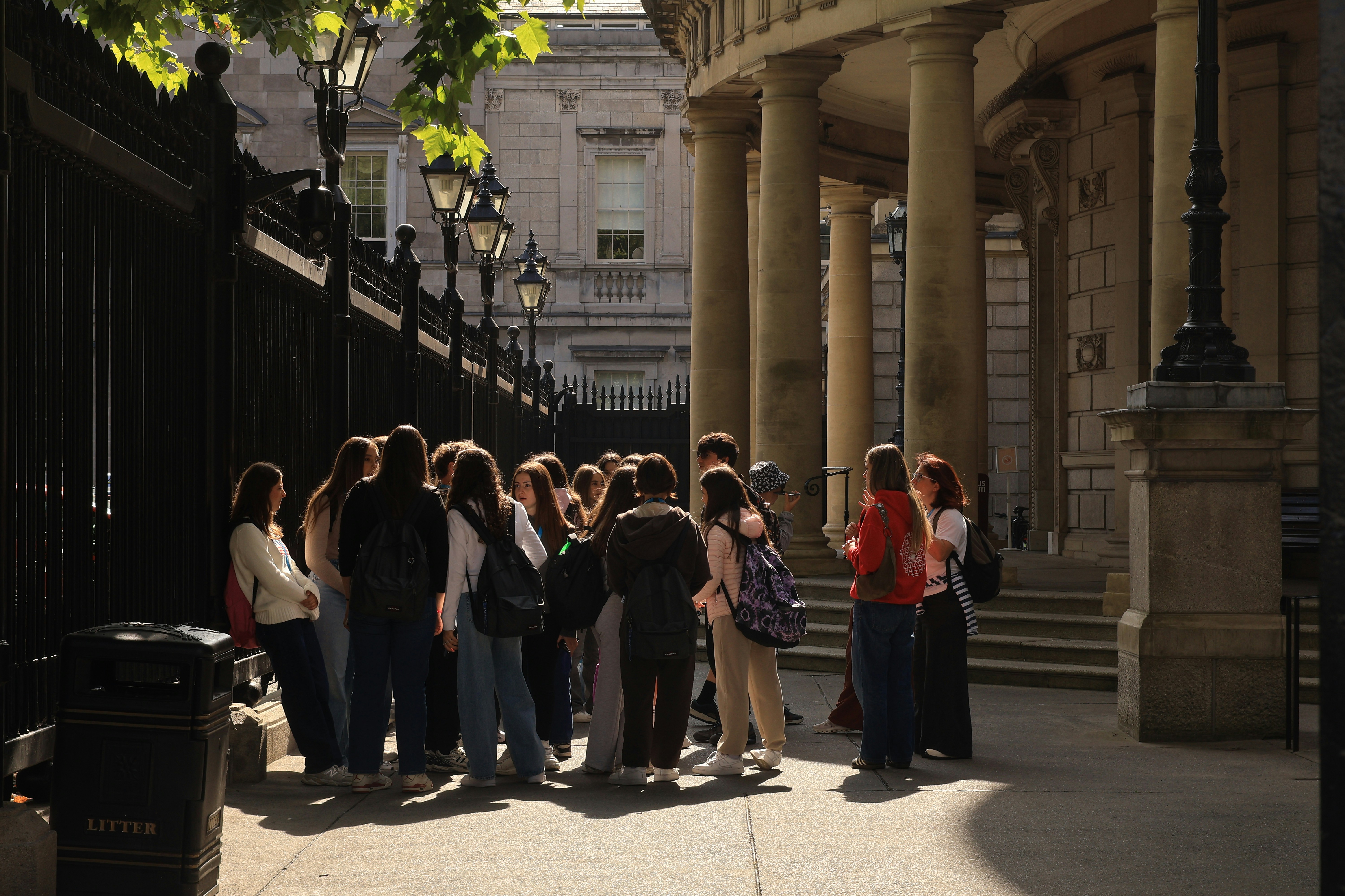 Courtyard Confluence: A Circle of Students in Golden Light