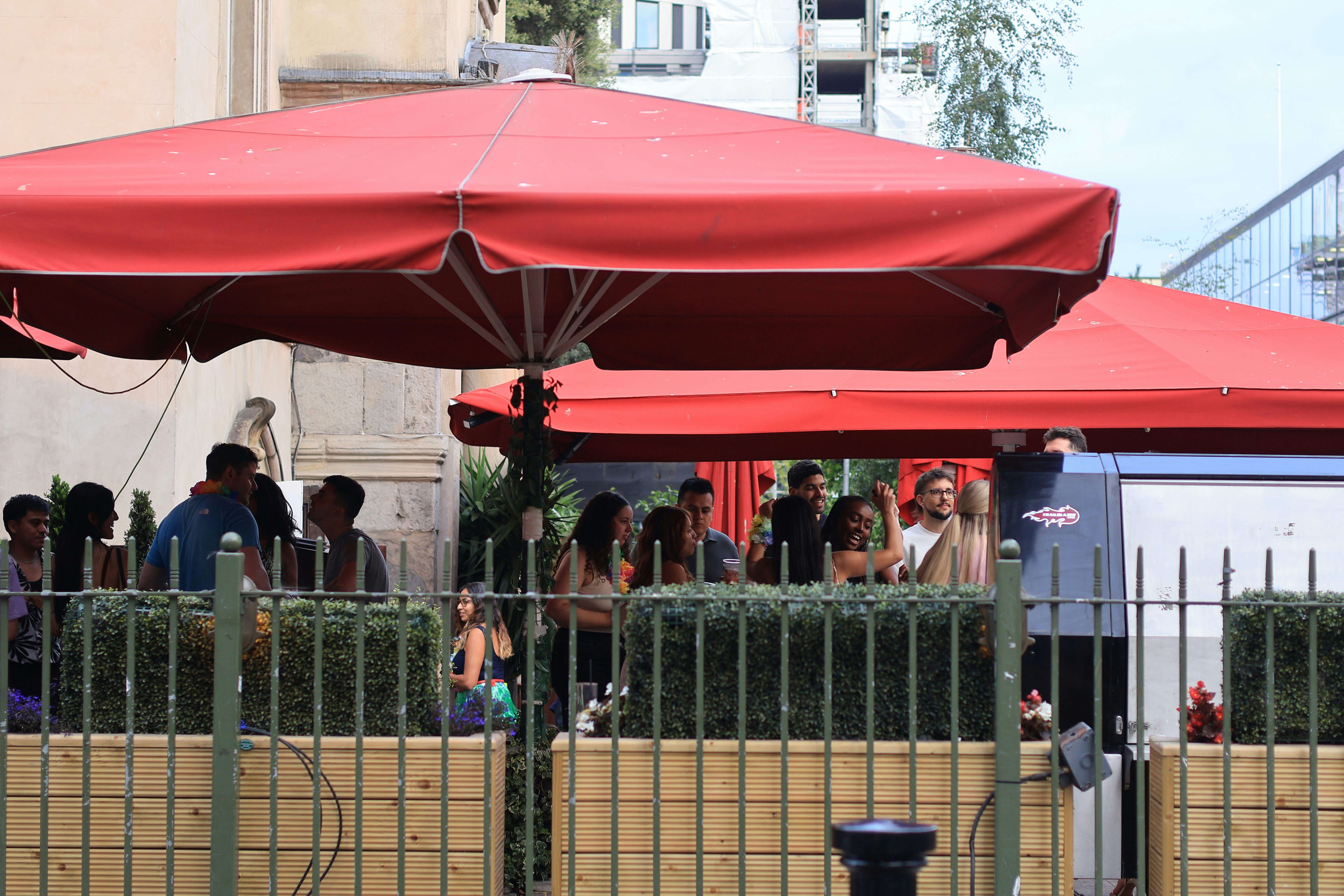Courtyard Conversation Under Red Canopies