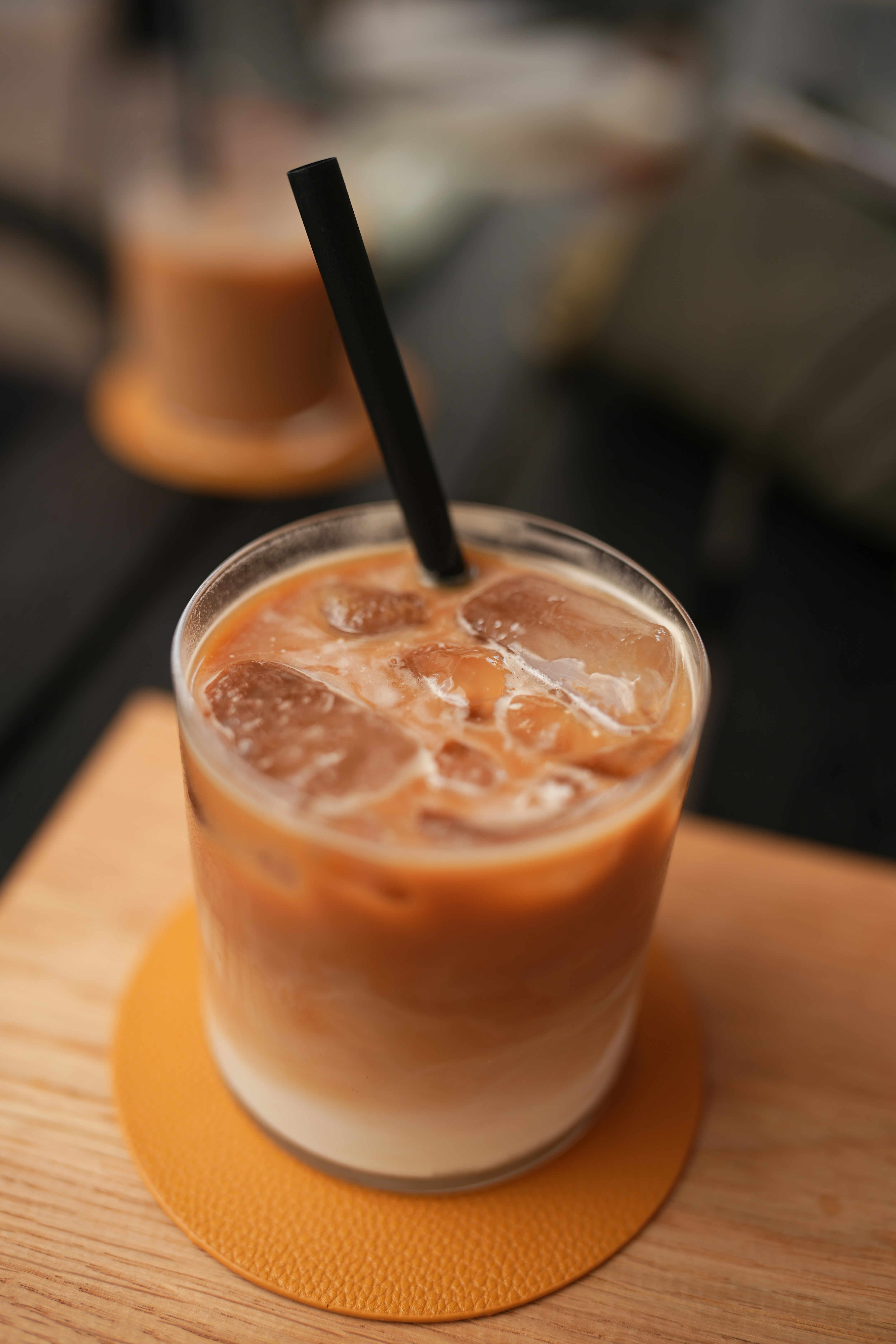 Iced Coffee Portrait: Layered Latte on a Wooden Stage