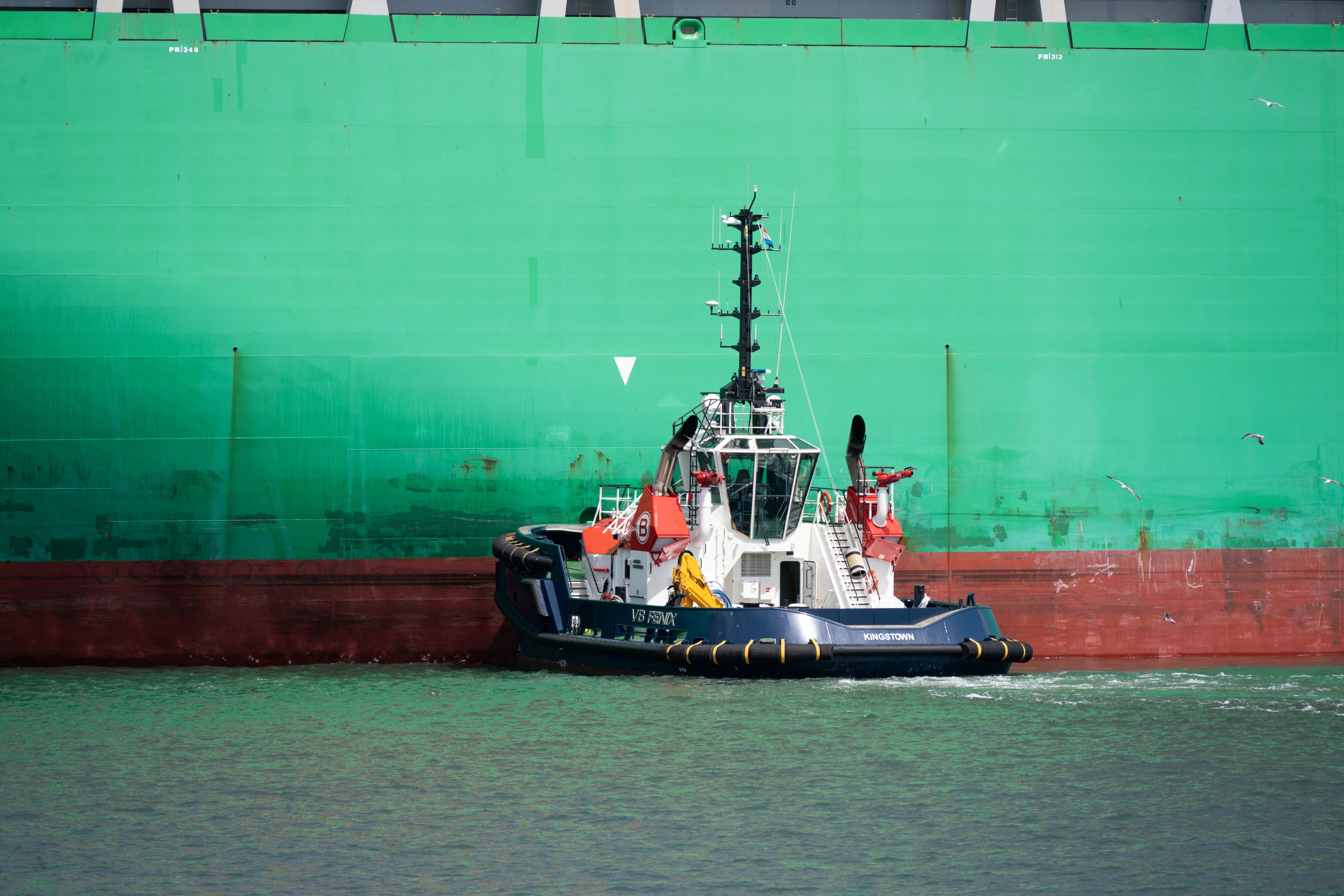 Towboat in Front of a Bright Green Hull