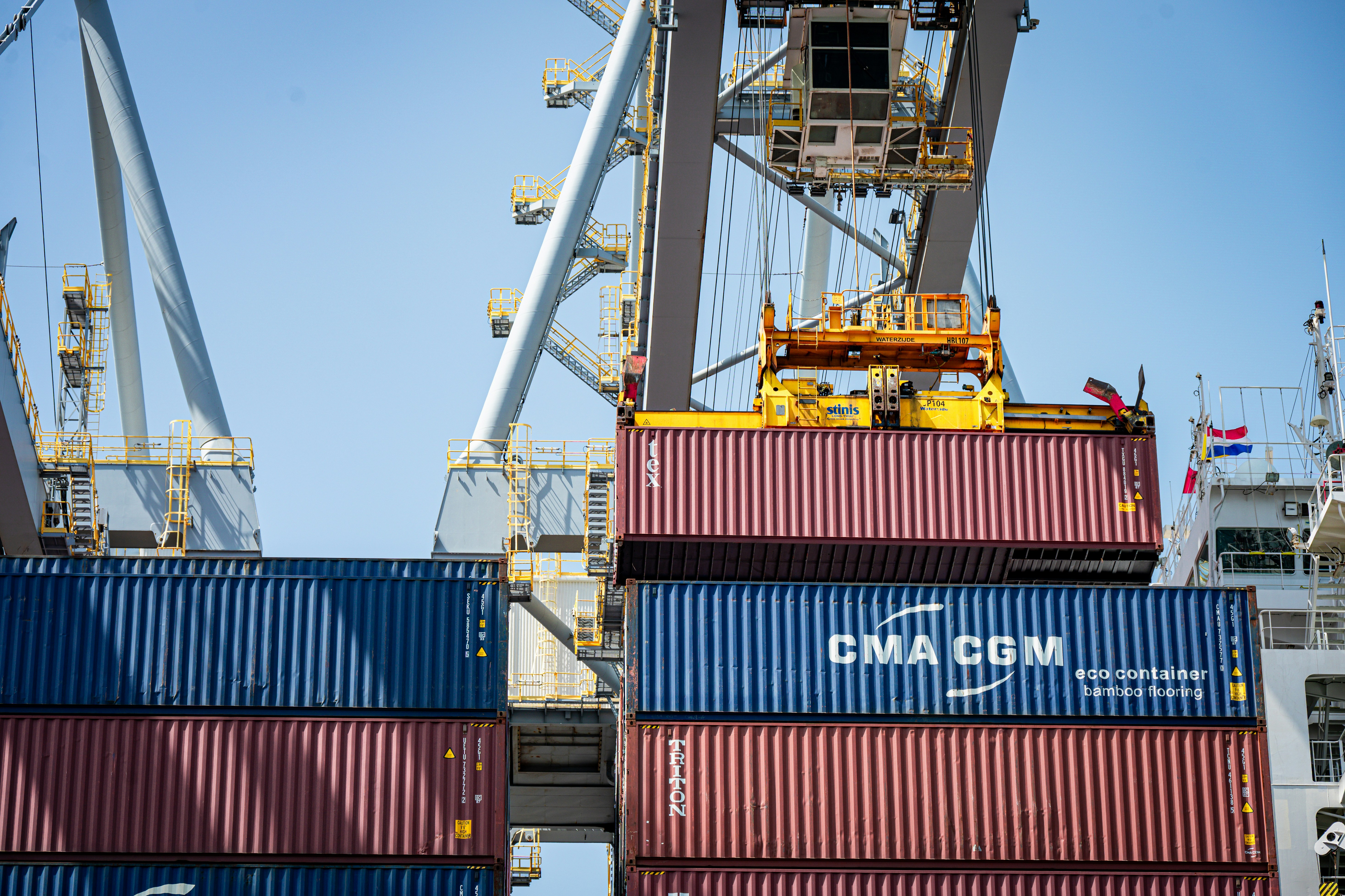 Crane Over Containers: A Machinery Skyline at Port