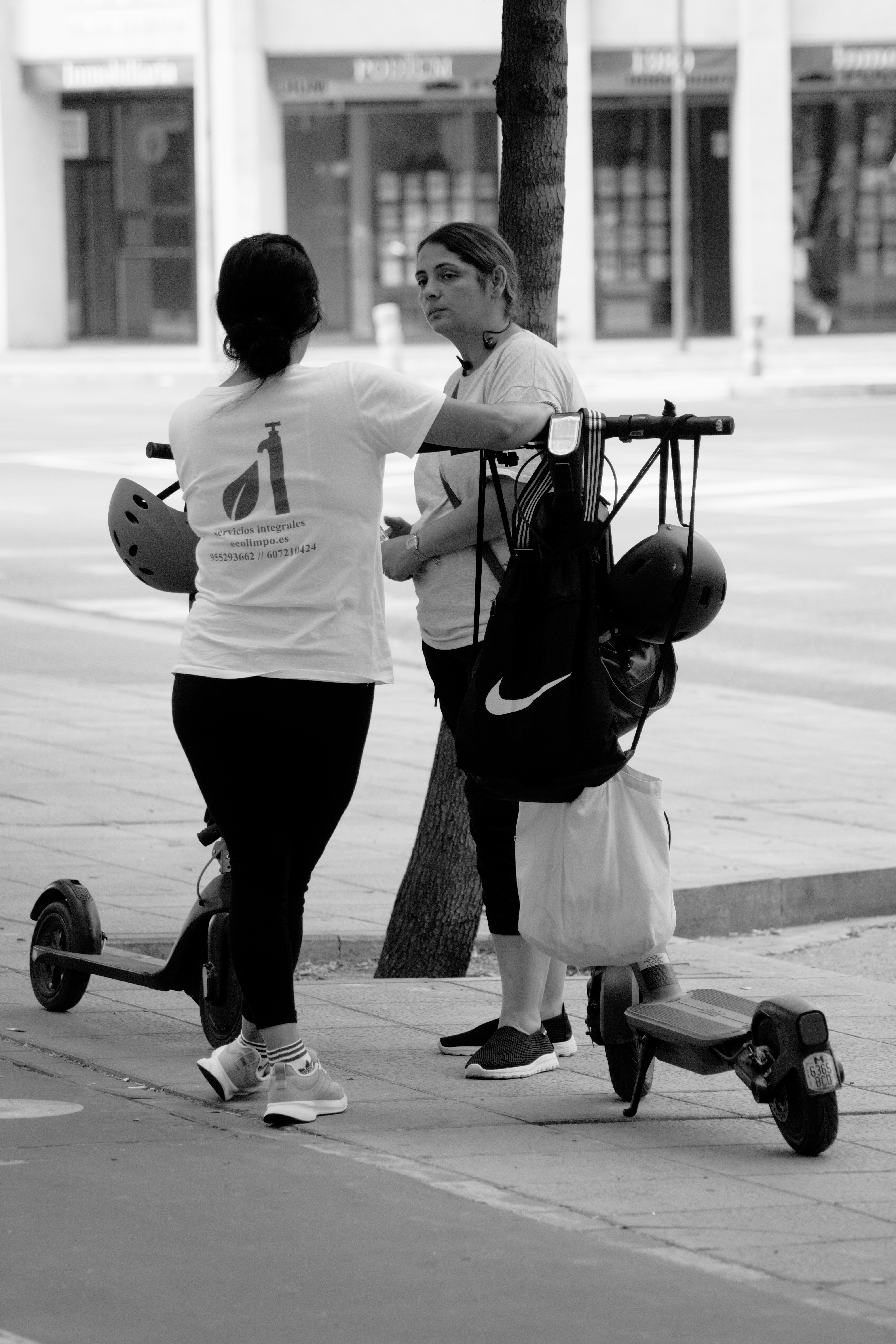 Two Friends with a Shared Moment on a City Street