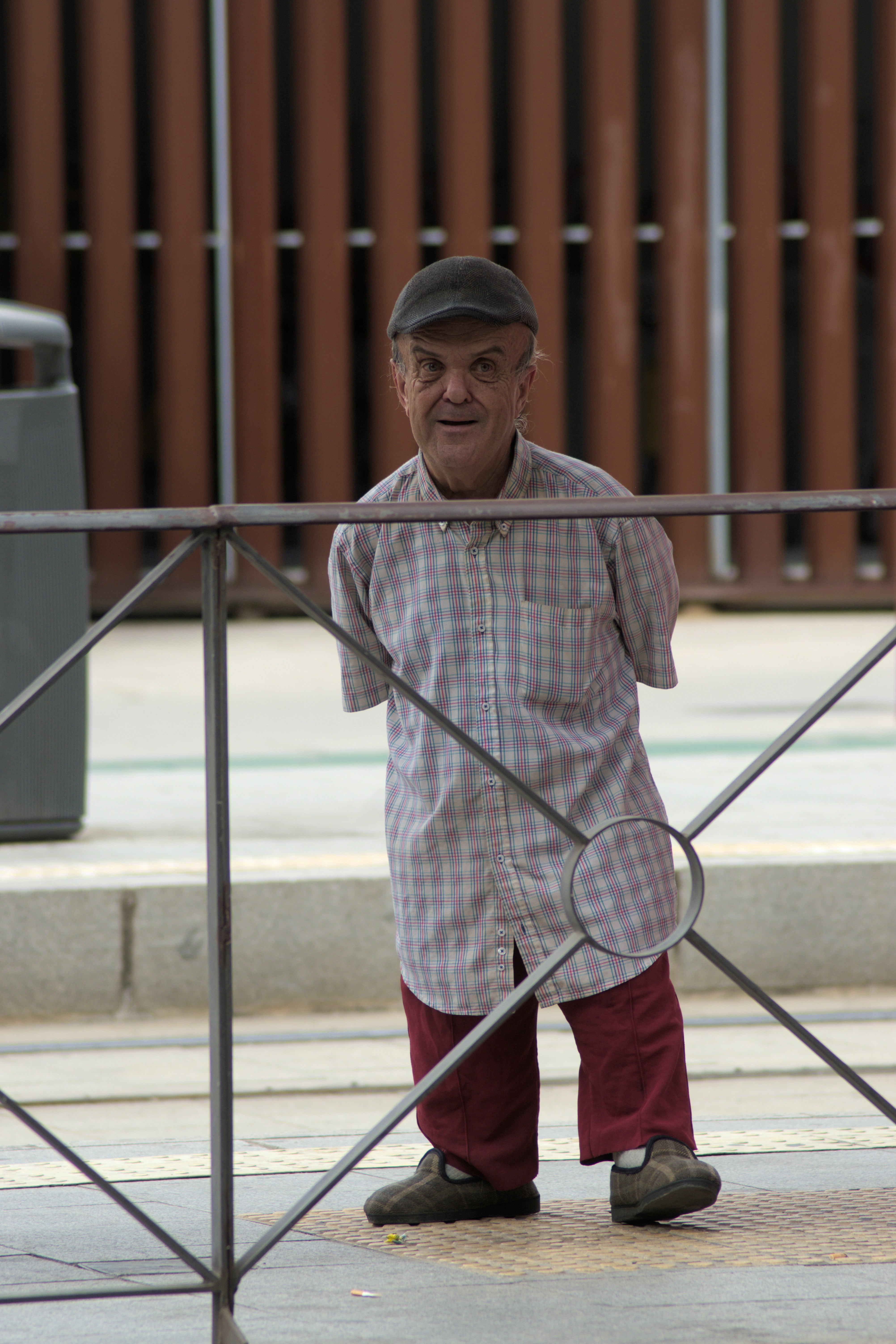 The Gentle Gatekeeper in Plaid and Beret
