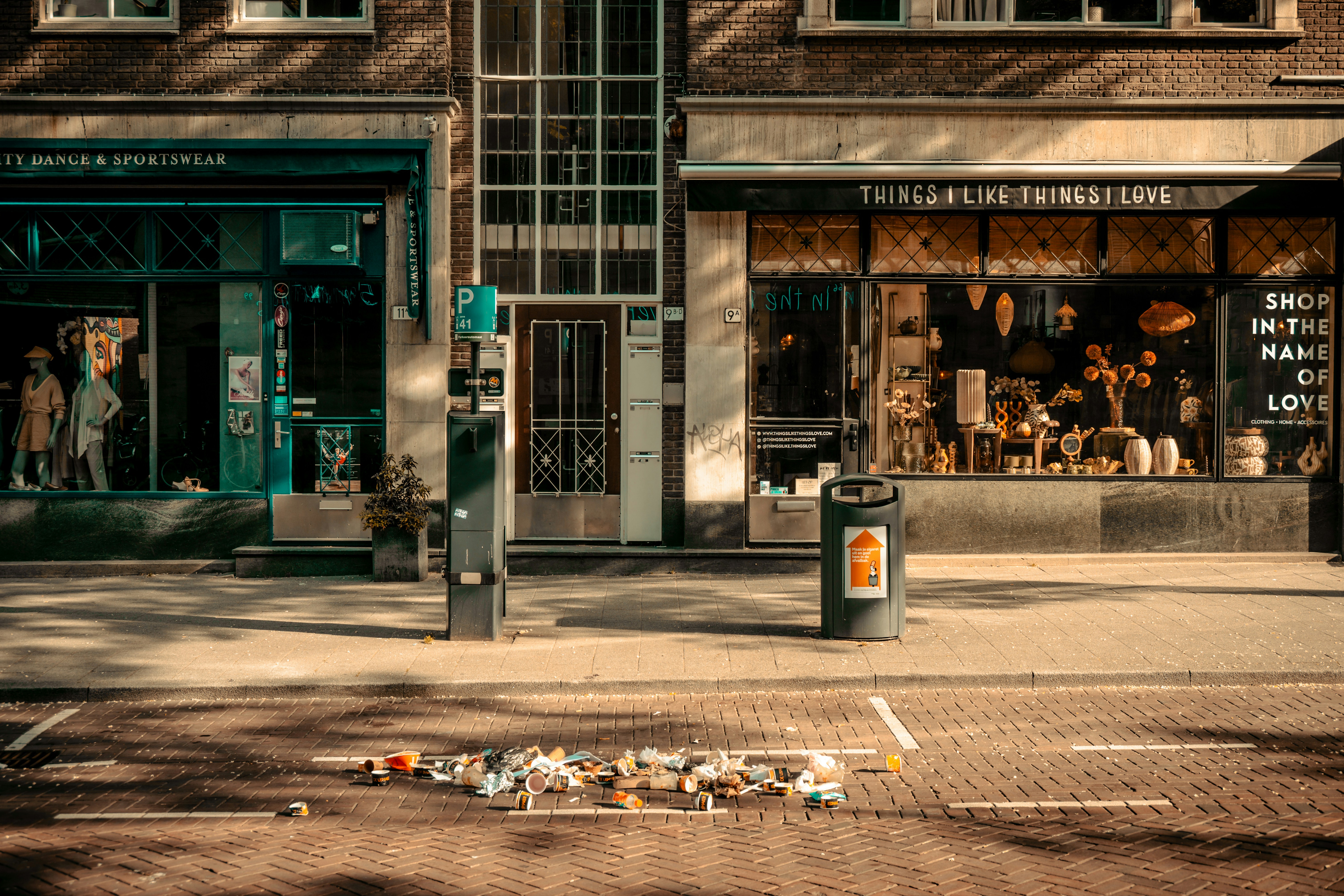 Street Shopfronts and Littered Gutter: Quiet City Moment