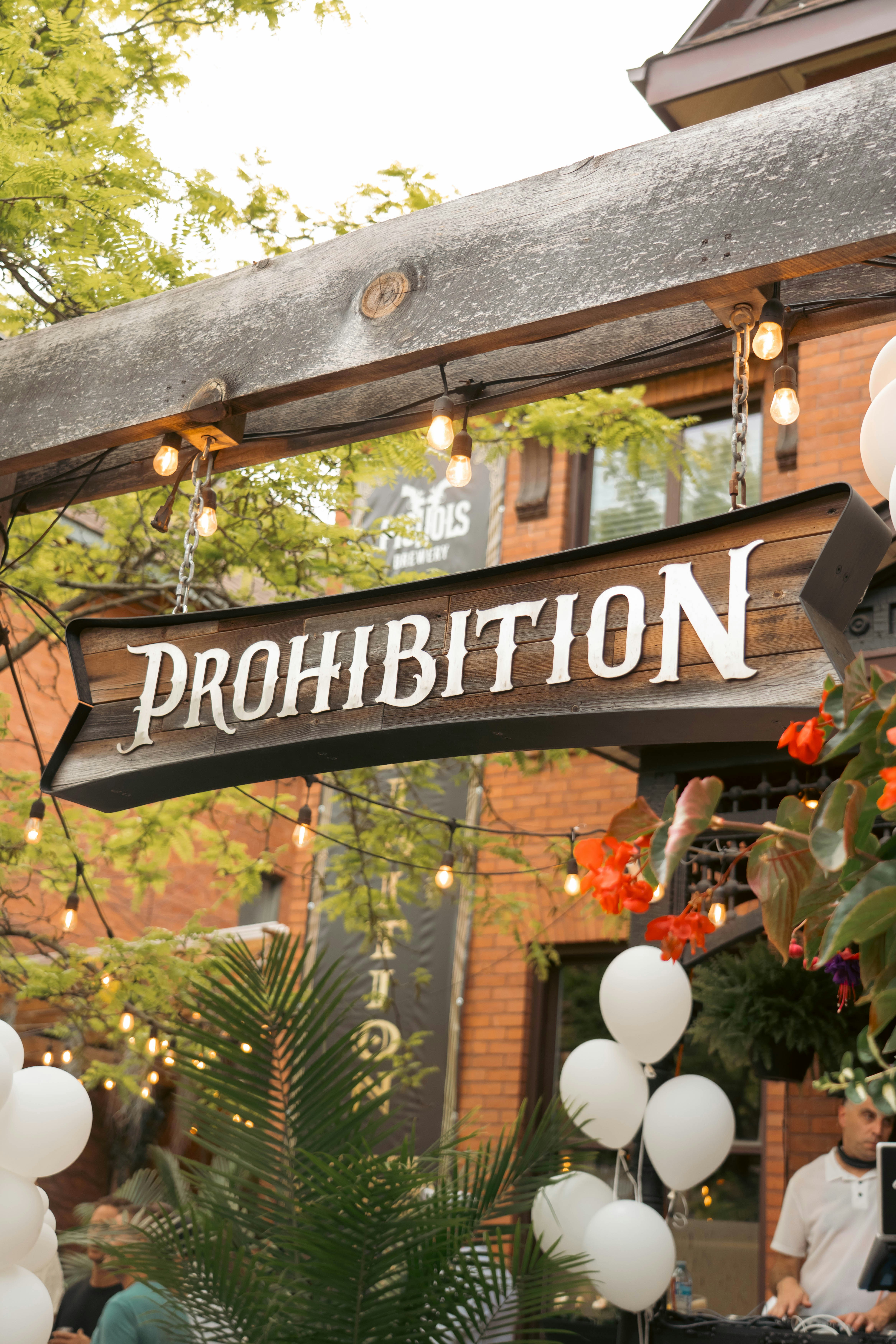 Prohibition Sign Beyond Lanterns: A Warm Urban Welcome