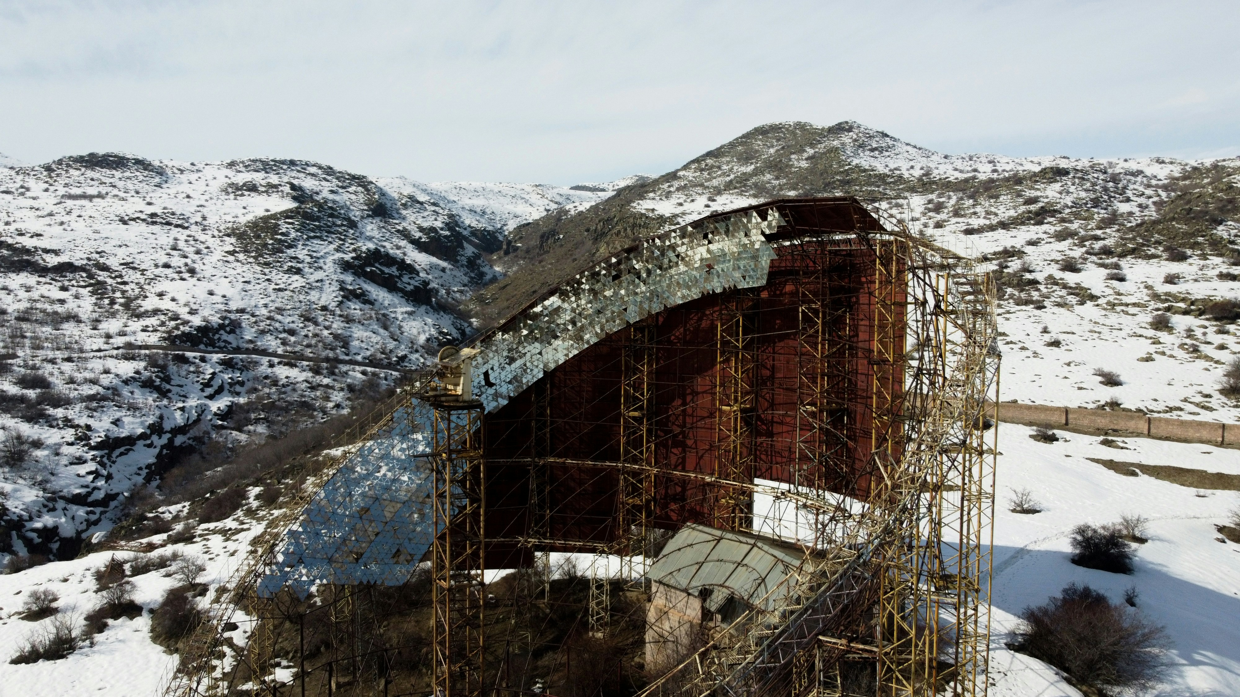 Snow-Scoured Arch: An Abandoned Venturer in the Hills